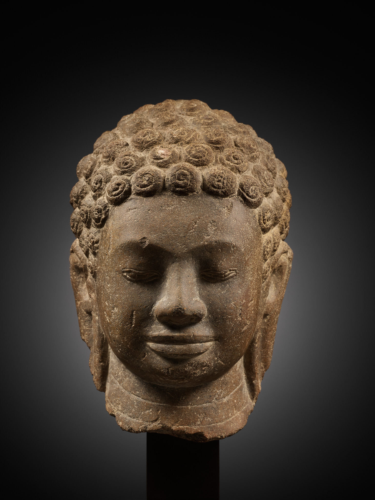 Lot 166 - A STONE HEAD OF BUDDHA, MON DVARAVATI PERIOD,