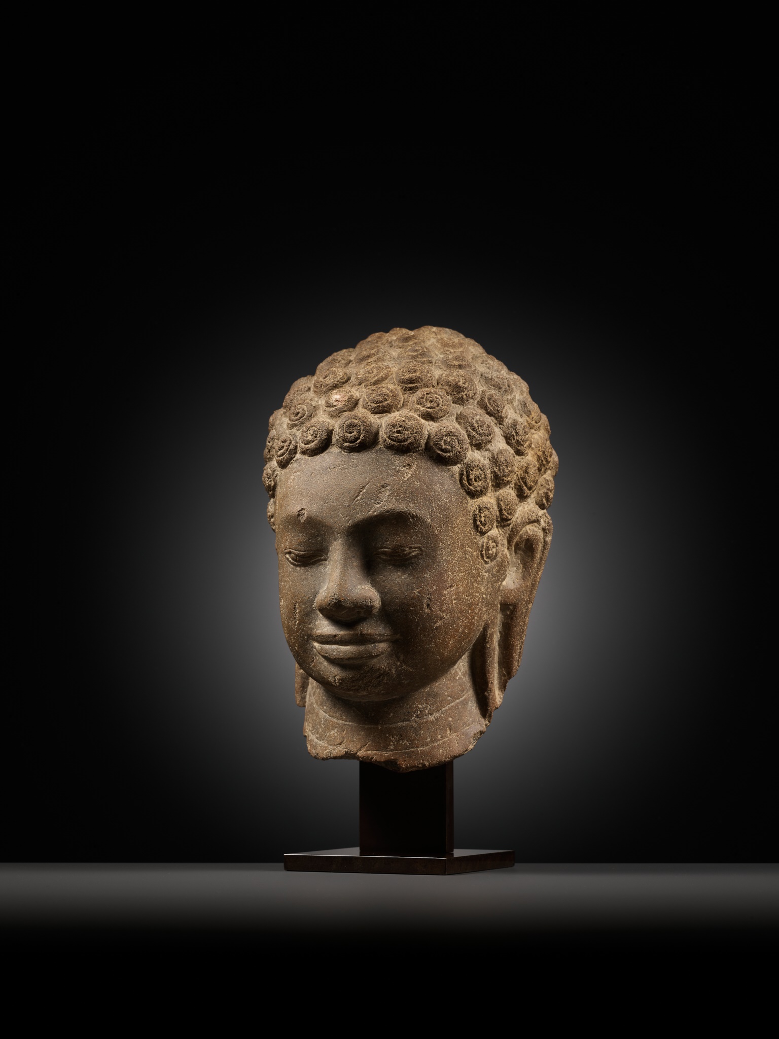 Lot 166 - A STONE HEAD OF BUDDHA, MON DVARAVATI PERIOD,