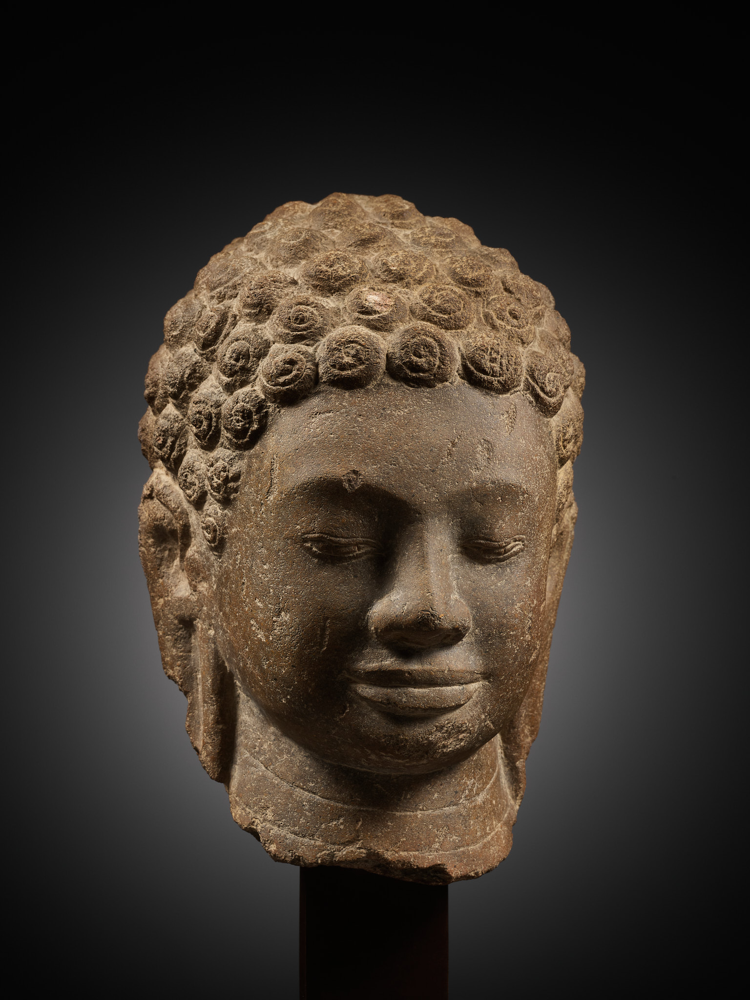 Lot 166 - A STONE HEAD OF BUDDHA, MON DVARAVATI PERIOD,