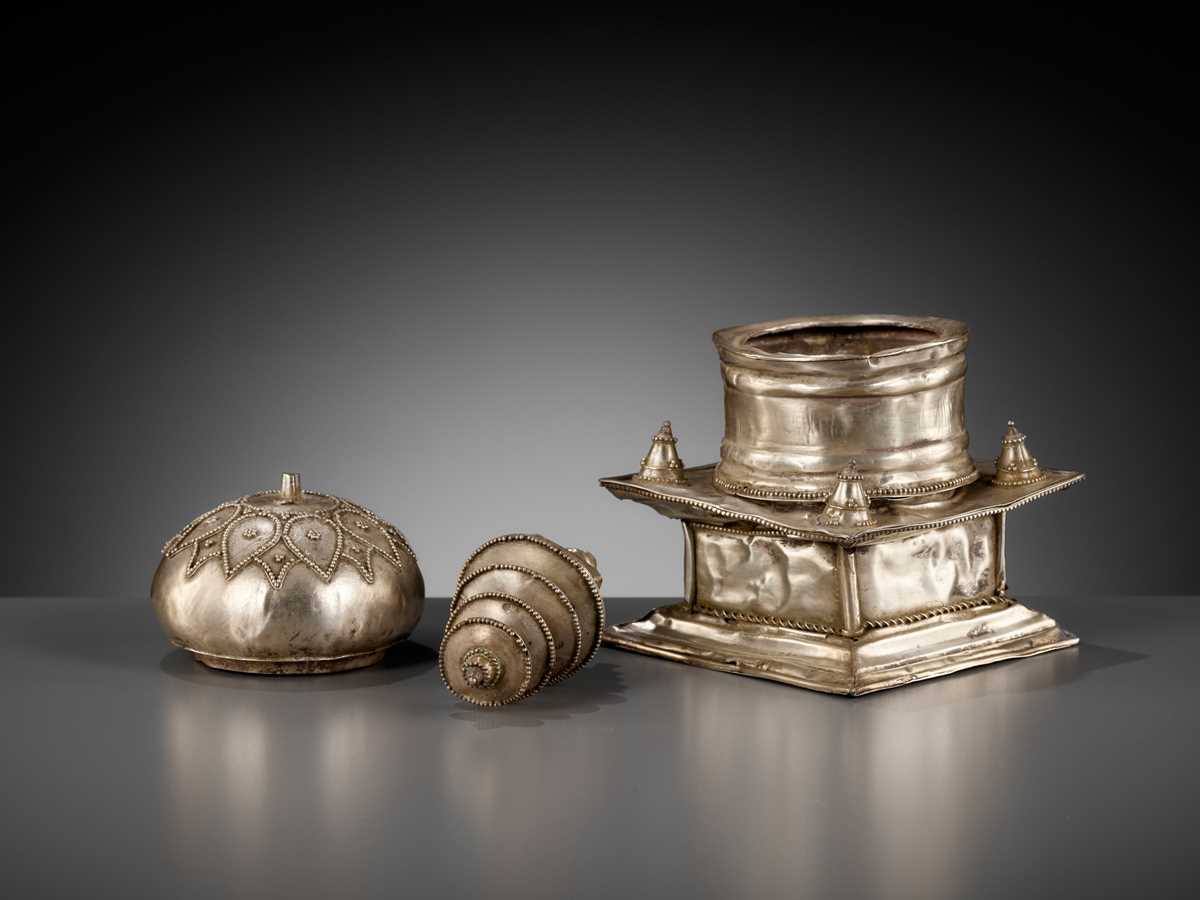 Lot 216 - A RARE SILVER REPOUSSÉ RELIQUARY IN THE FORM
