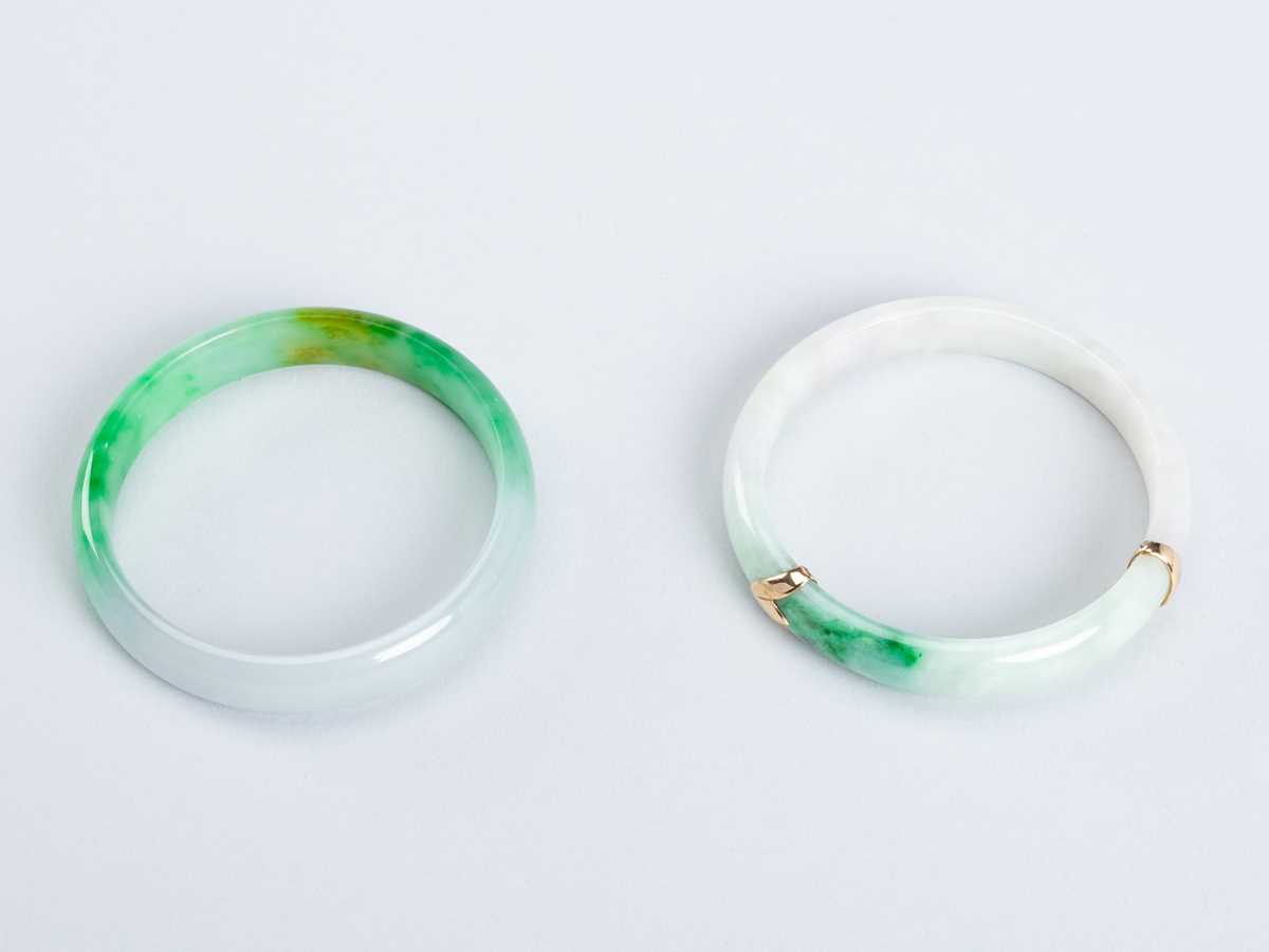 Lot 905 - A GROUP OF TWO JADEITE BANGLES