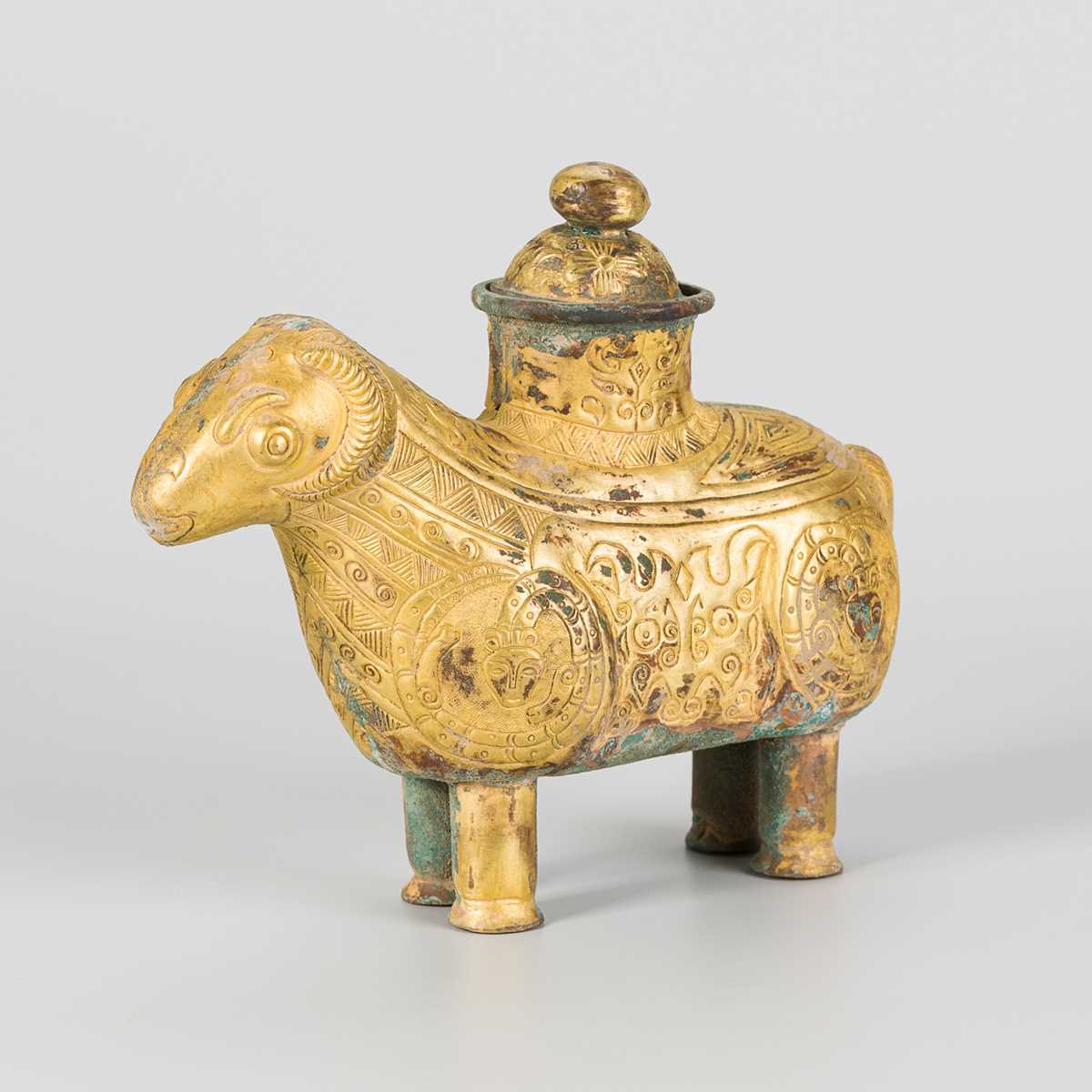 Lot 767 - AN ARCHAISTIC FIRE-GILT COPPER REPOUSSÉ