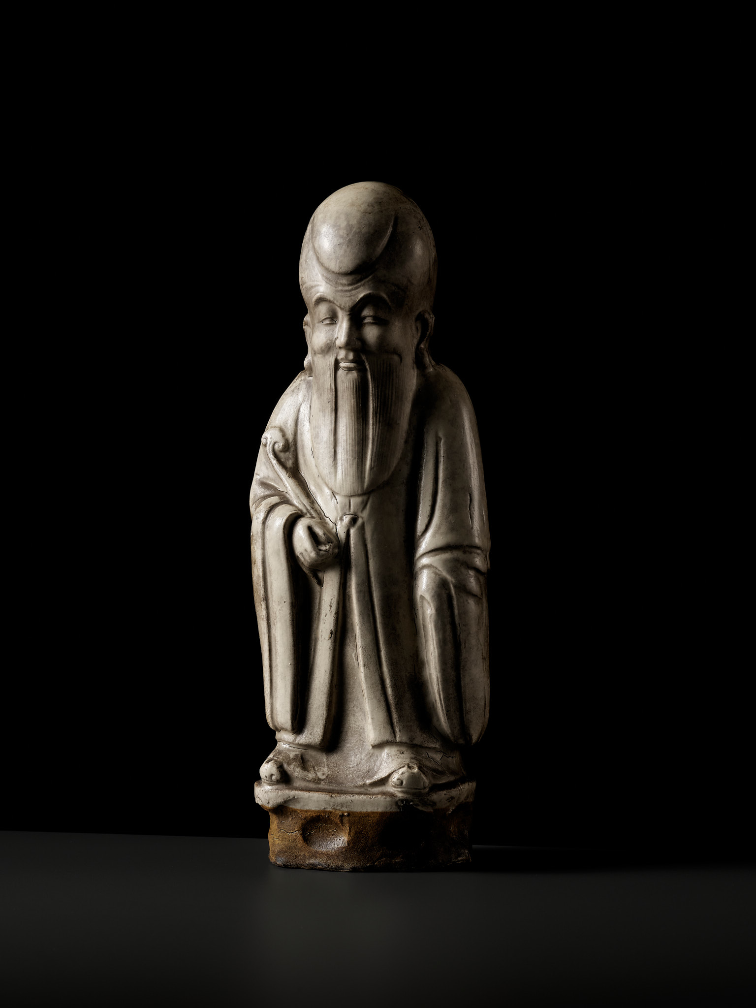 Lot 142 - A RARE AND IMPORTANT FIGURE OF SHOULAO, DING