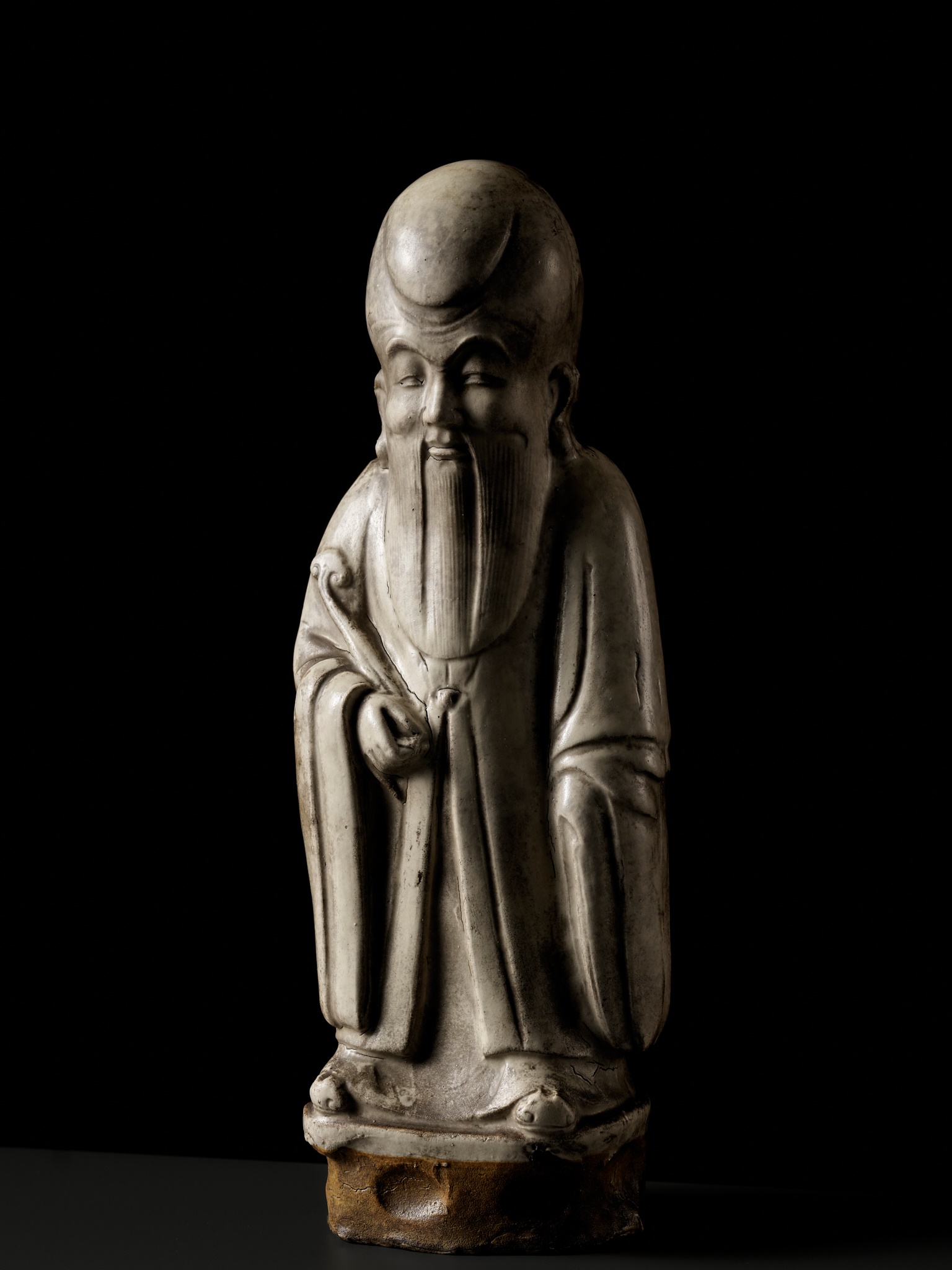 Lot 142 - A RARE AND IMPORTANT FIGURE OF SHOULAO, DING
