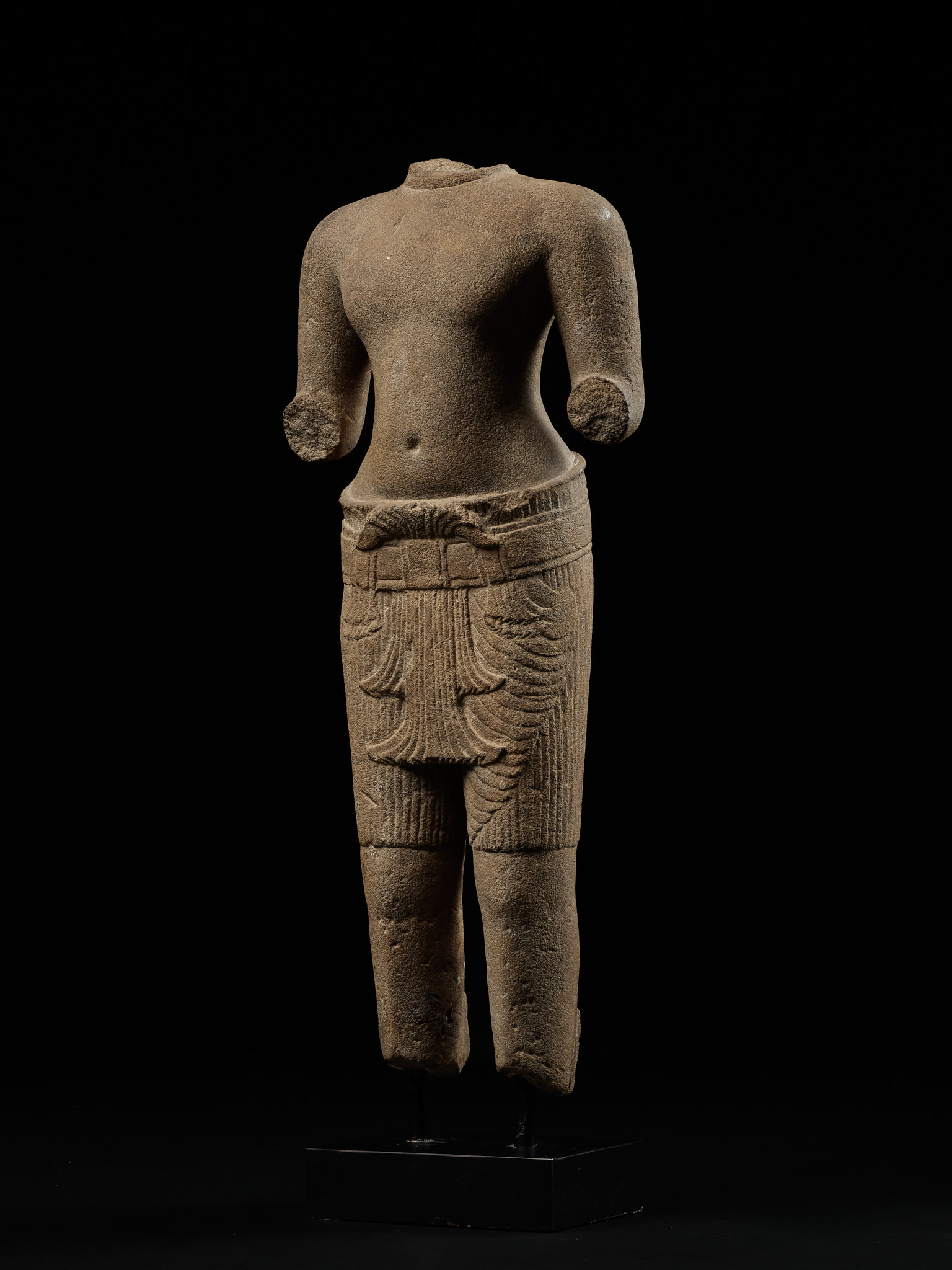 Lot 187 - A KHMER GRAY SANDSTONE TORSO OF A MALE DEITY,