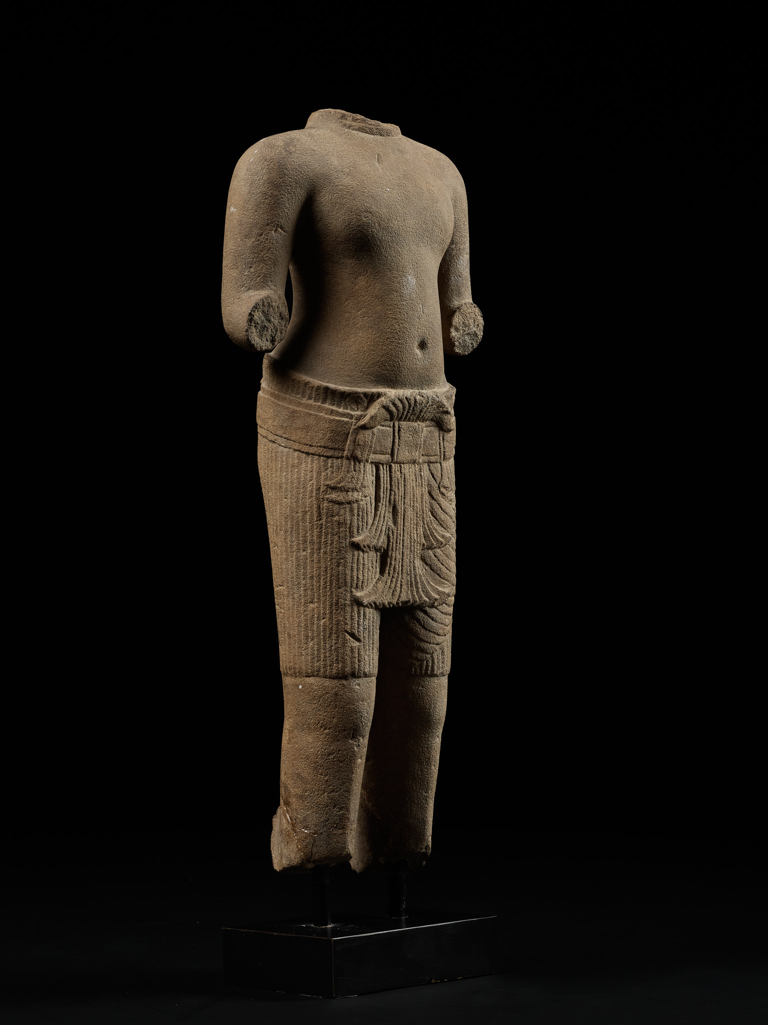 Lot 187 - A KHMER GRAY SANDSTONE TORSO OF A MALE DEITY,