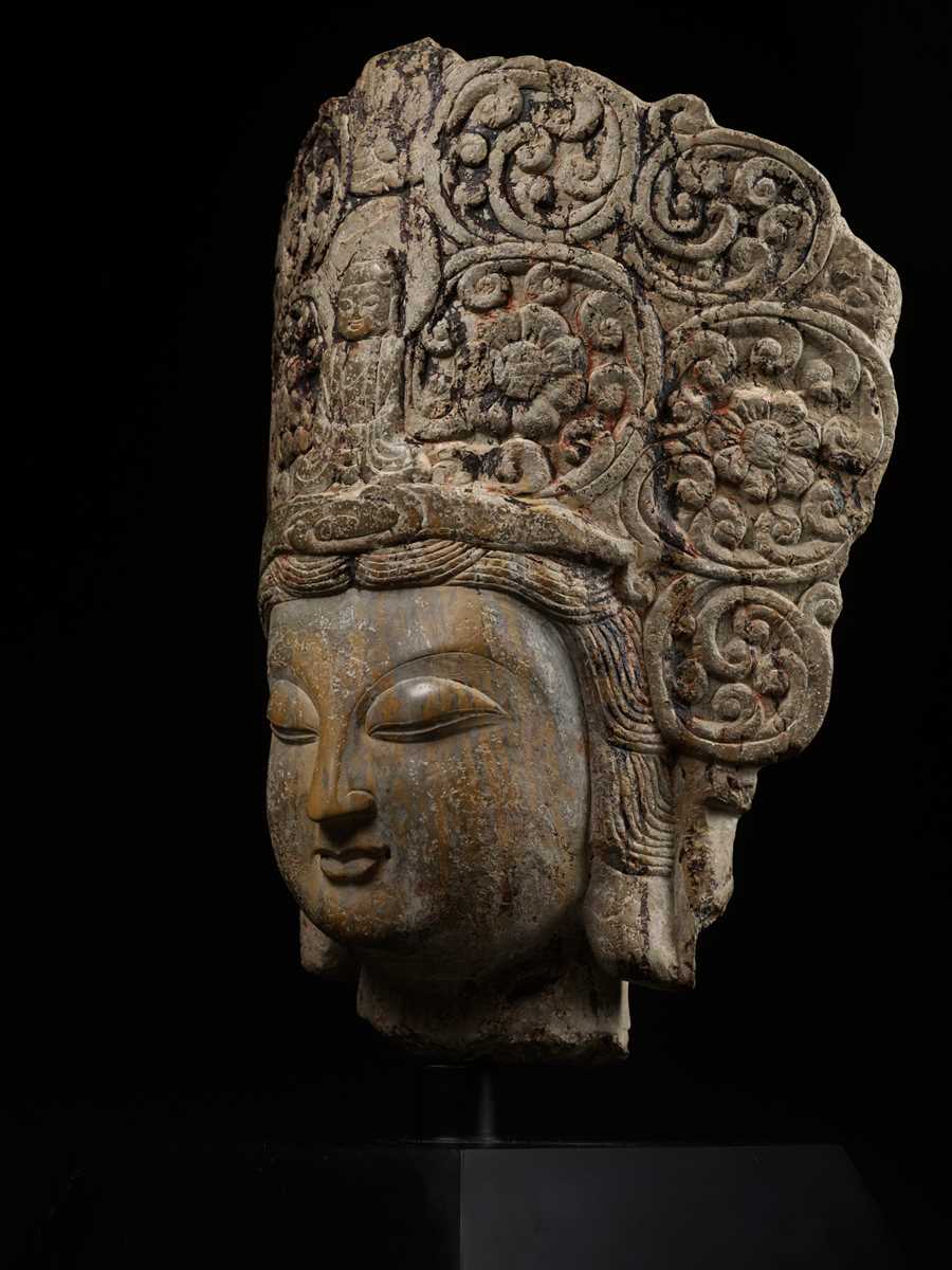 Lot 43 - A RARE AND MASSIVE CARVED LIMESTONE HEAD OF