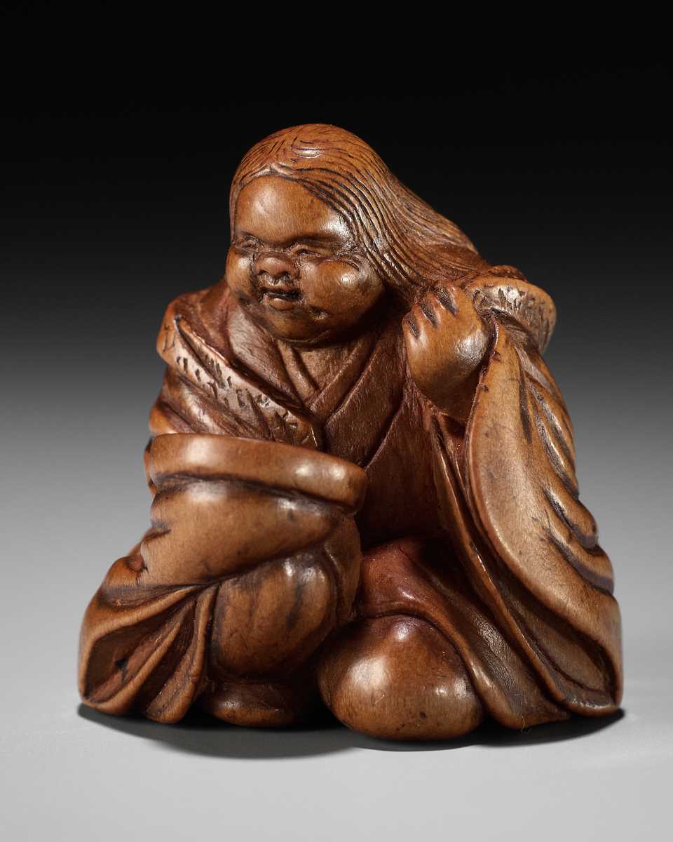 Lot 150 - JOBUN: A VERY RARE WOOD NETSUKE OF OKAME