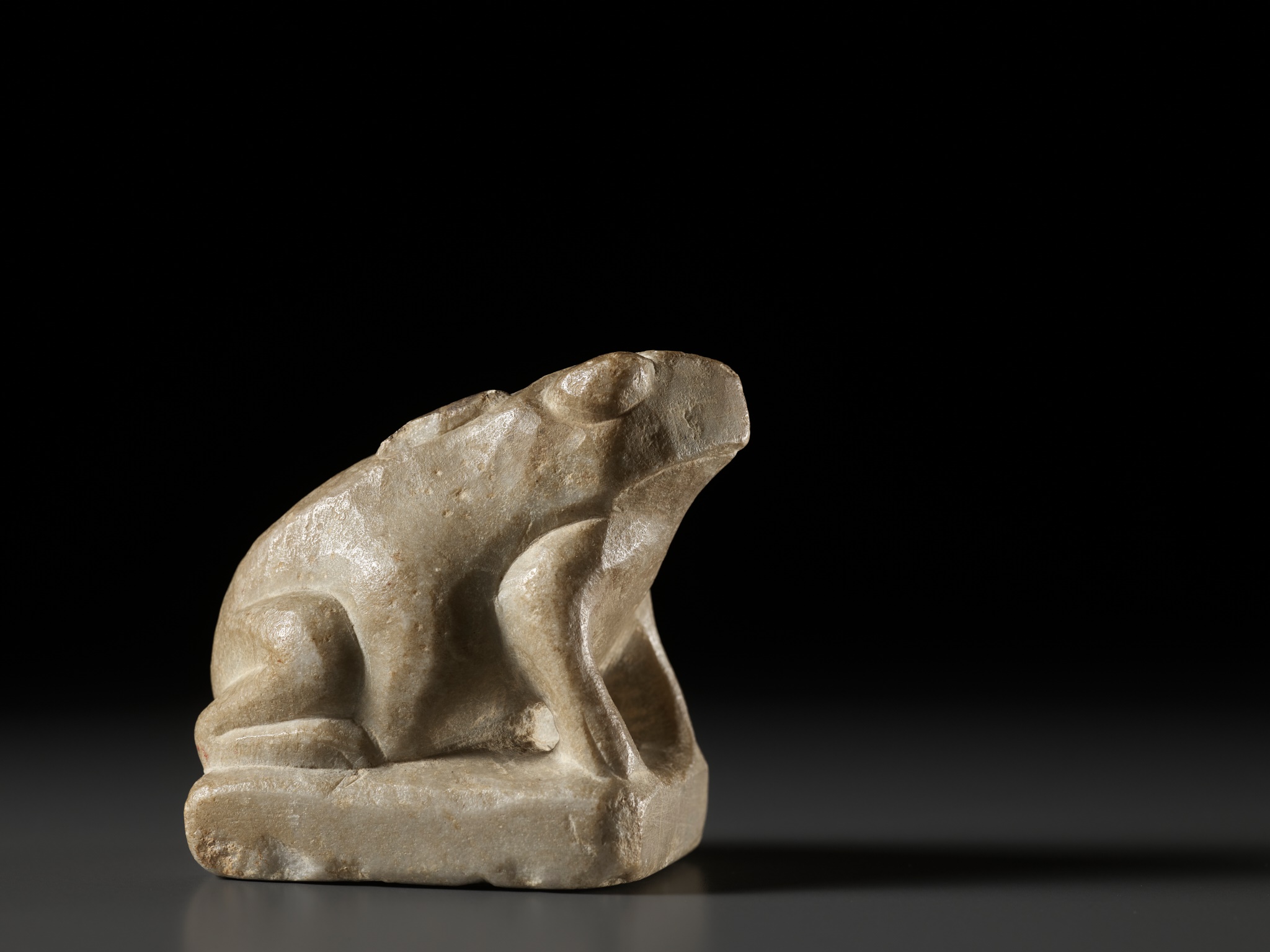Lot 100 - A RARE WHITE MARBLE FIGURE OF A FROG, TANG