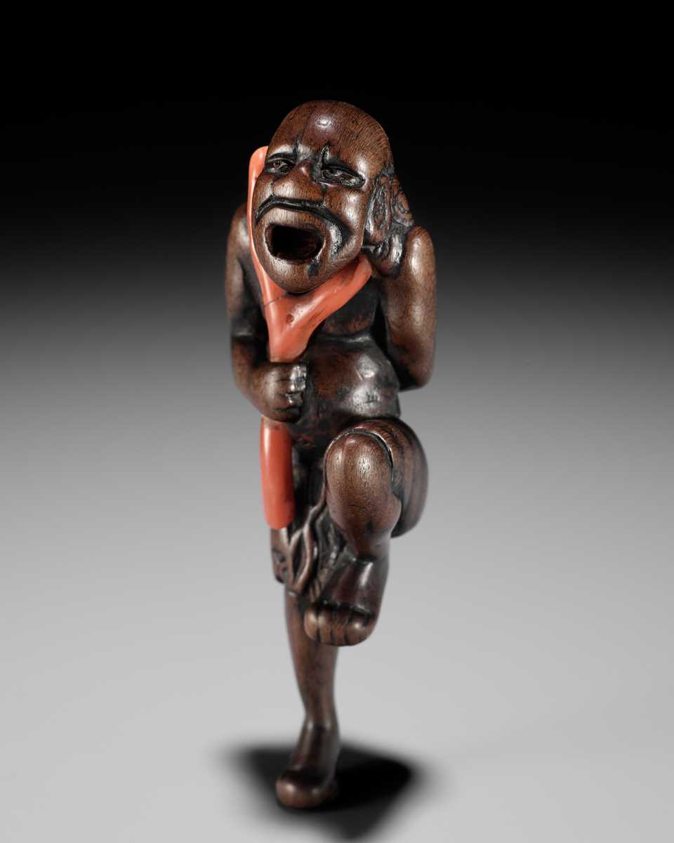 Lot 145 - A POWERFUL WOOD NETSUKE OF A SOUTH SEA CORAL