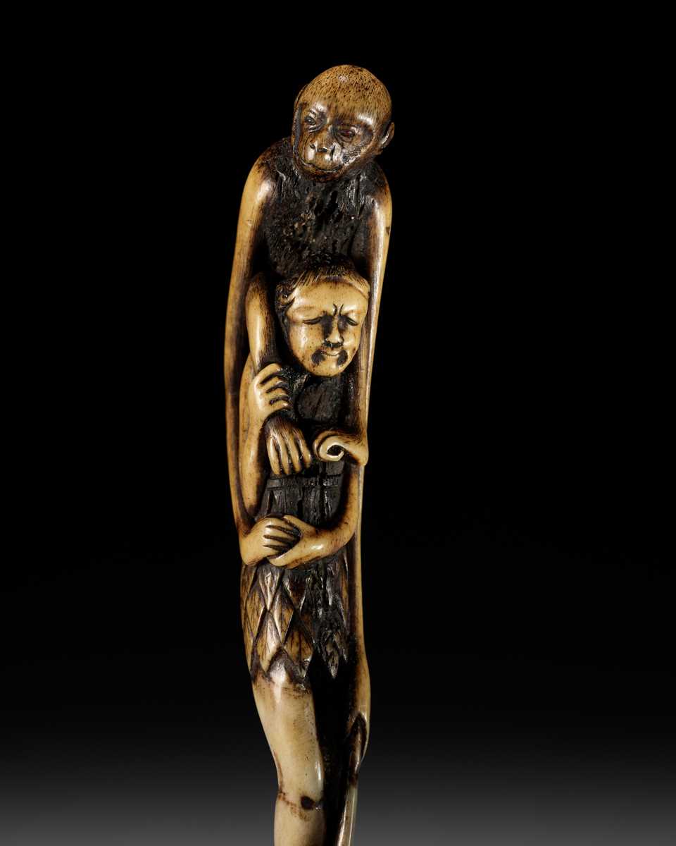 Lot 273 - A FINE ANTLER NETSUKE OF ASHINAGA WITH A