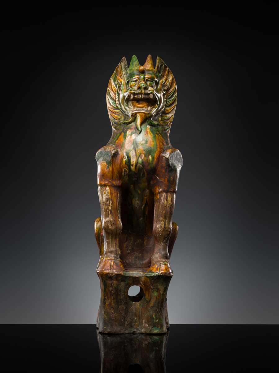 Lot 132 - A SANCAI-GLAZED FIGURE OF A LEONINE EARTH