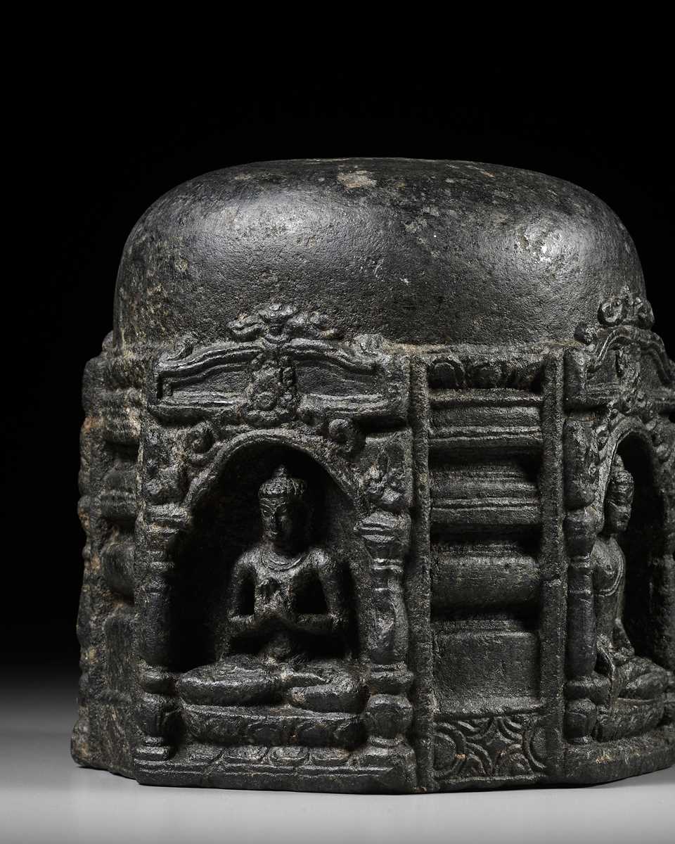 Lot 249 - A BLACK STONE STUPA DRUM WITH FOUR BUDDHAS,