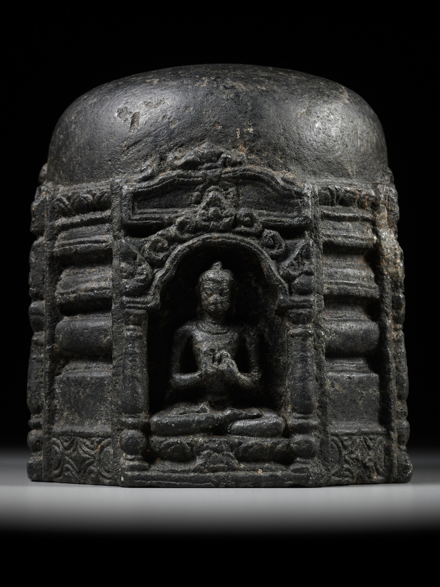 Lot 249 - A BLACK STONE STUPA DRUM WITH FOUR BUDDHAS,