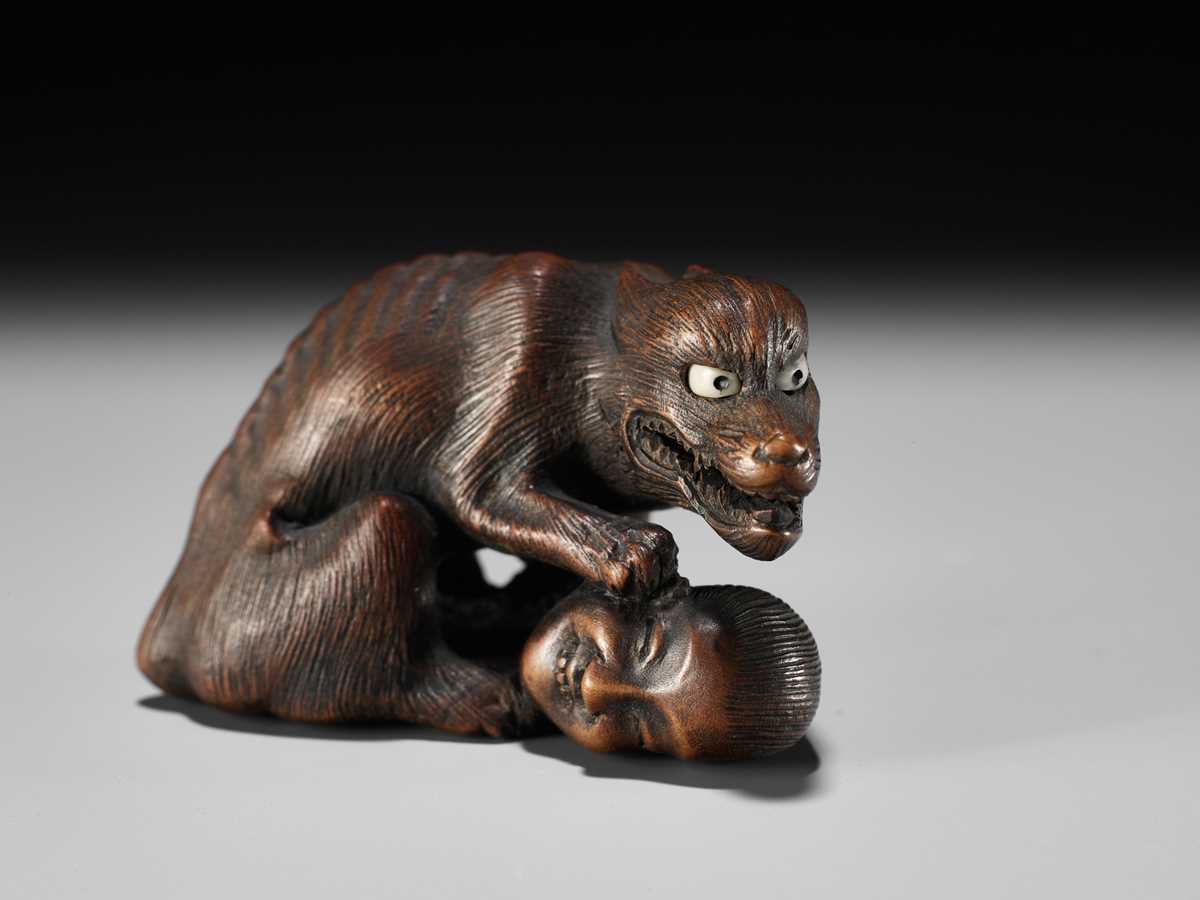Lot 125 - SHIGEKAZU: A FINE WOOD NETSUKE OF AN