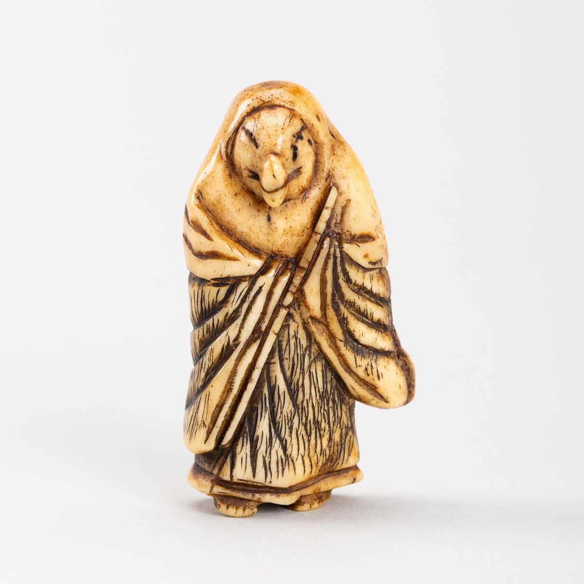 Lot 626 - A STAG ANTLER NETSUKE OF A FOX PRIEST