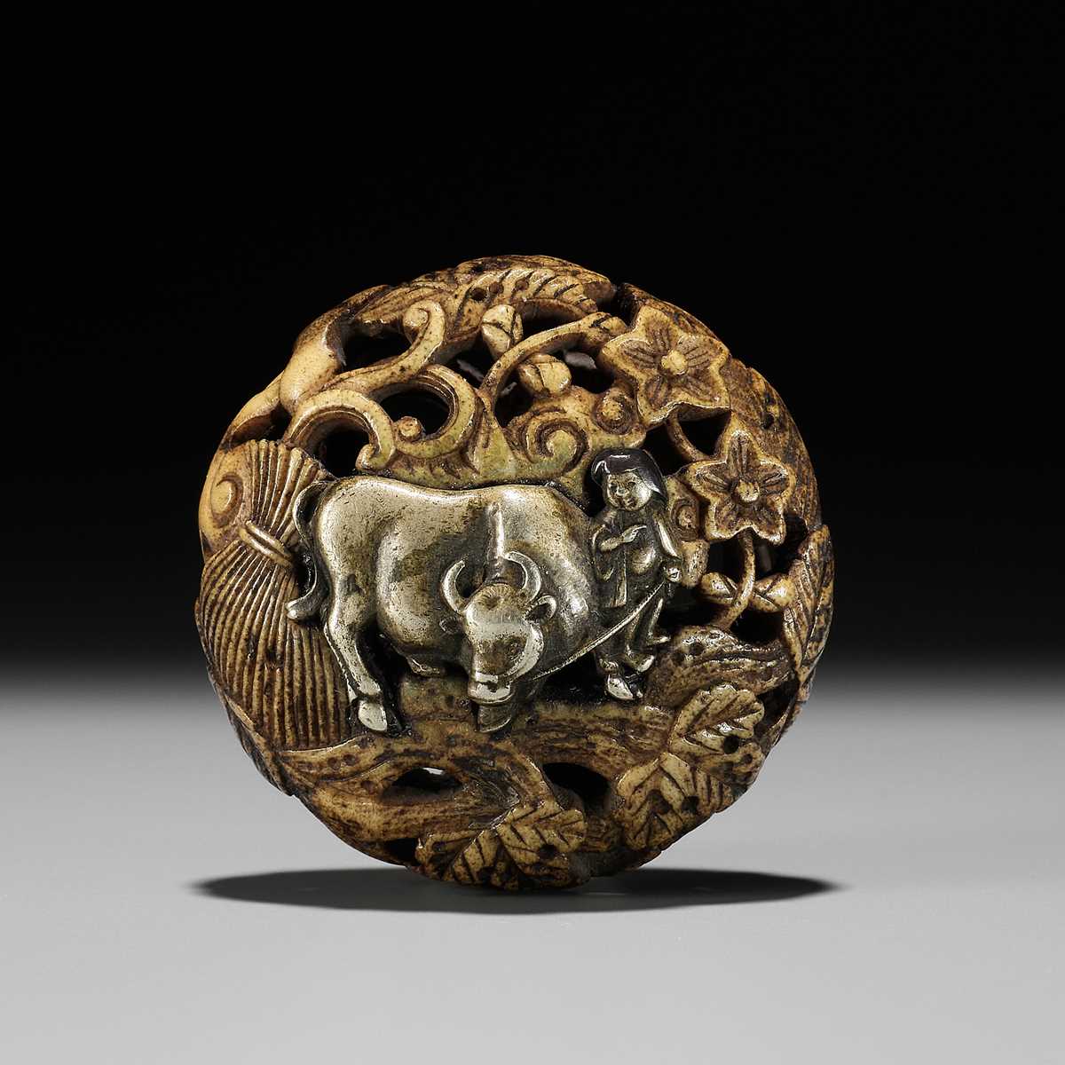 Lot 271 - A METAL-INLAID ANTLER RYUSA MANJU NETSUKE