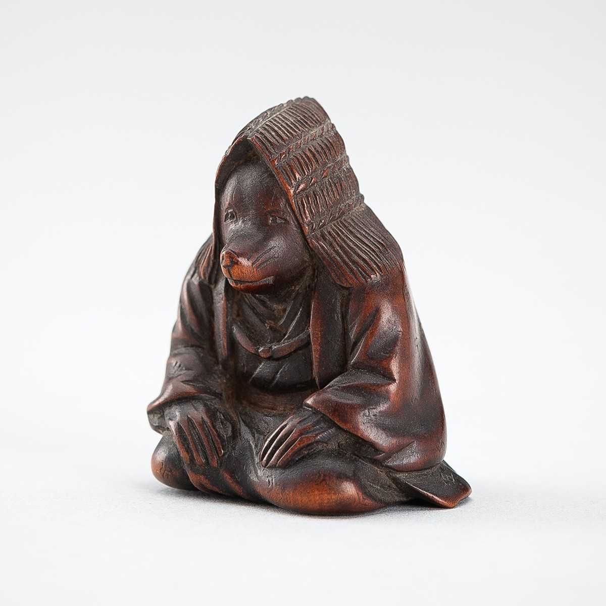 Lot 504 - A WOOD NETSUKE OF A FOX PRIEST (HAKUZOSU)