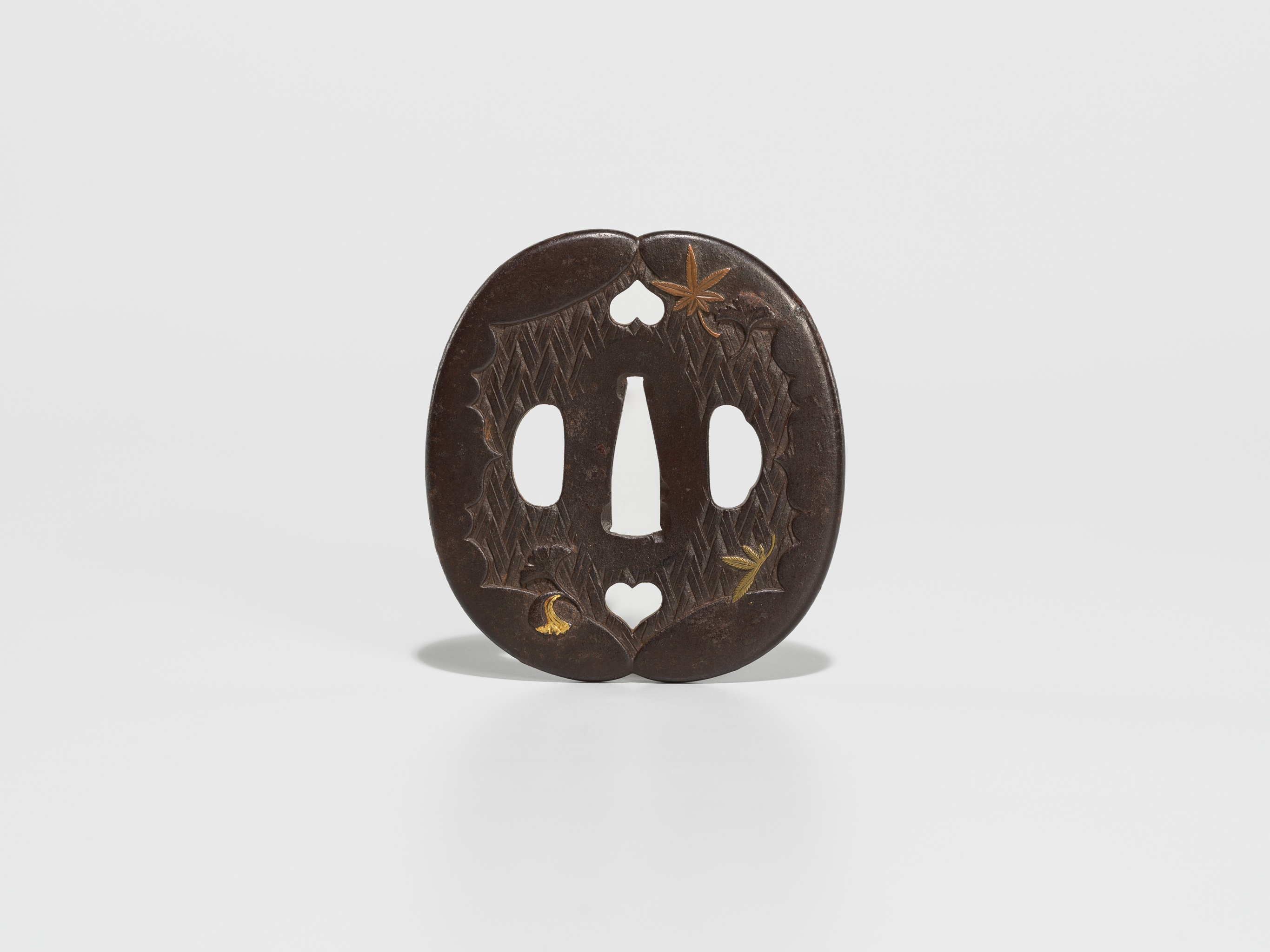 Lot 189 - A RARE IRON SUKASHI TSUBA WITH MAPLE AND