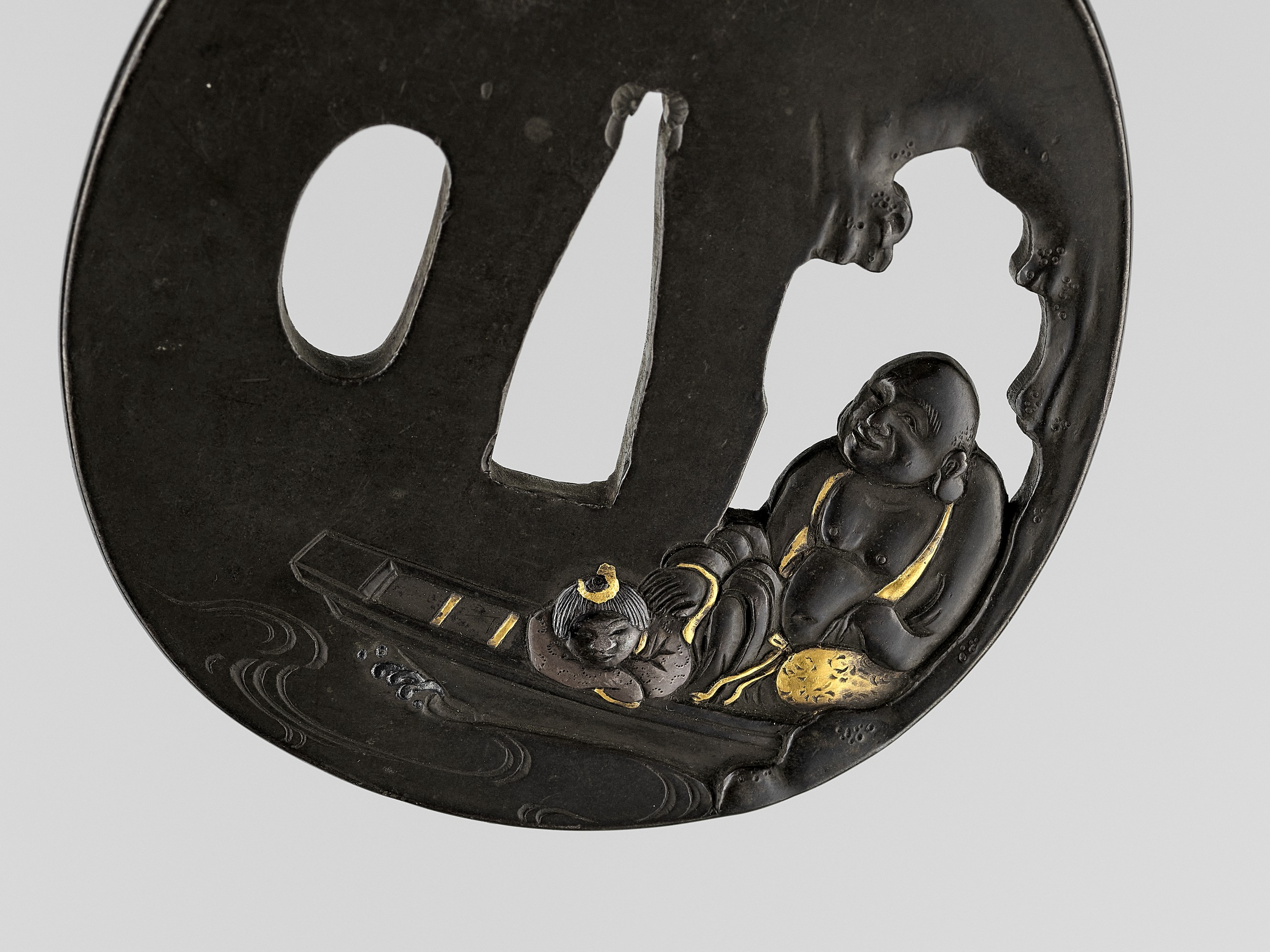 Lot 63 - TOSHIHISA: A SHIBUICHI TSUBA WITH HOTEI AND