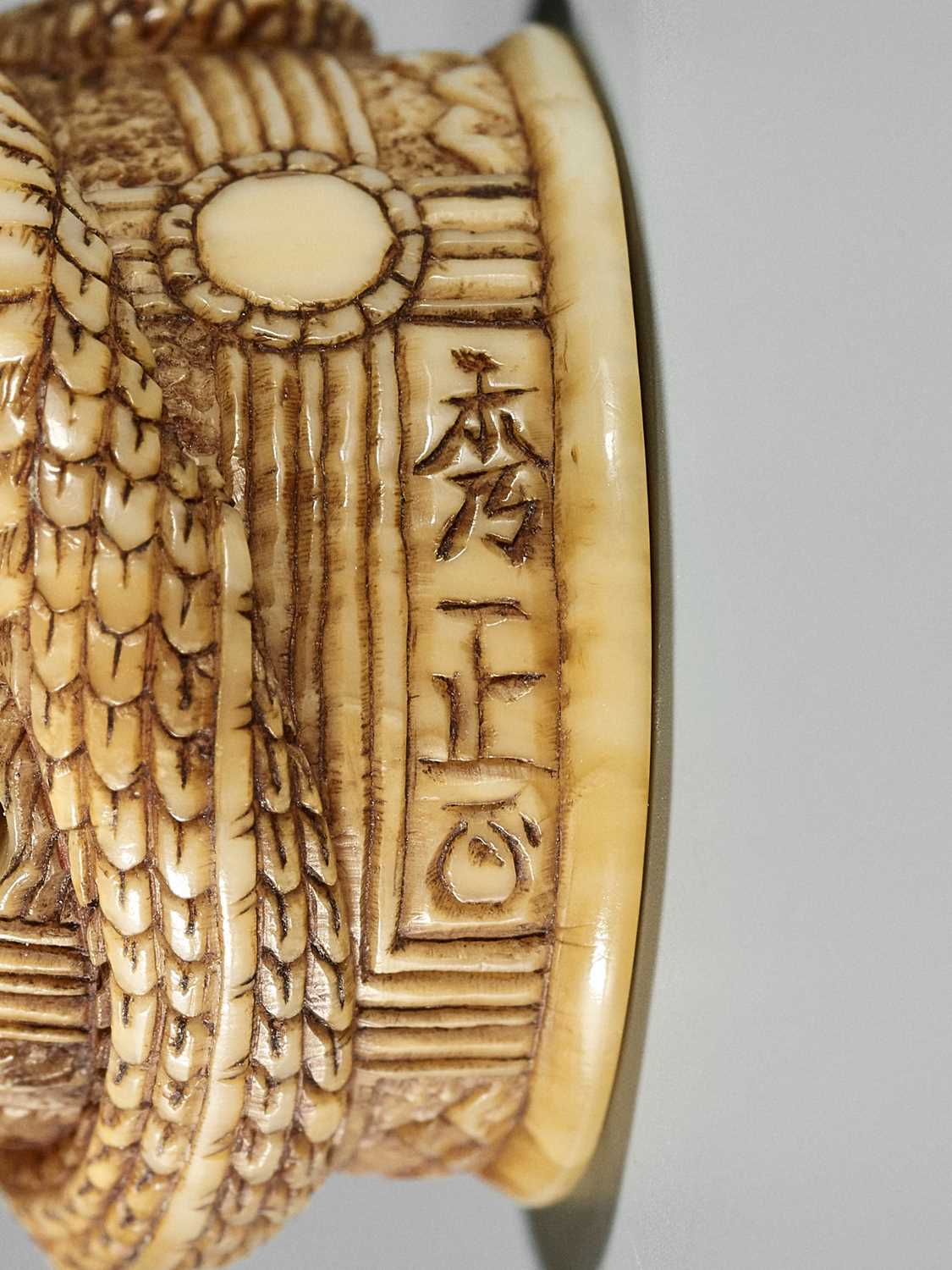 Lot 37 - HIDEMASA: A FINE IVORY NETSUKE OF KIYOHIME