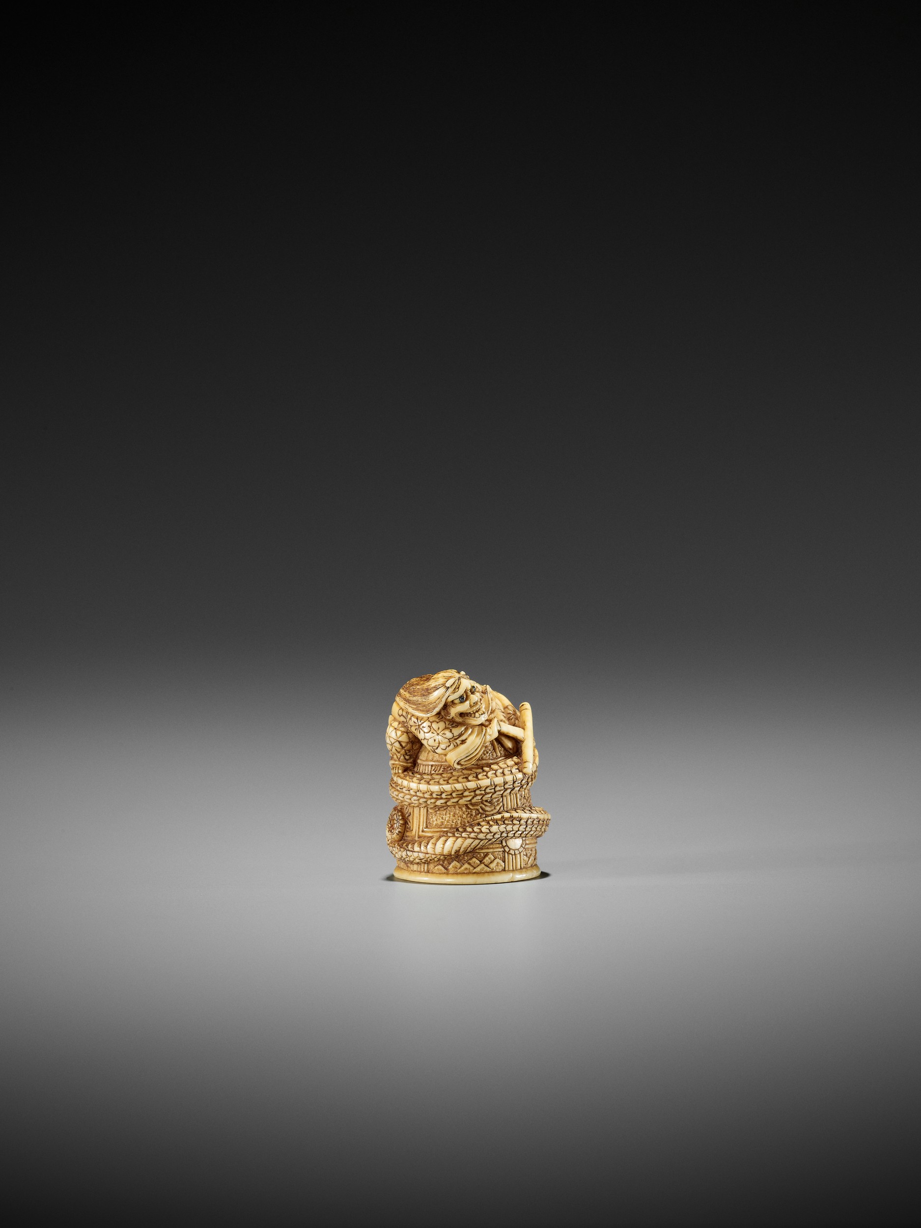 Lot 37 - HIDEMASA: A FINE IVORY NETSUKE OF KIYOHIME