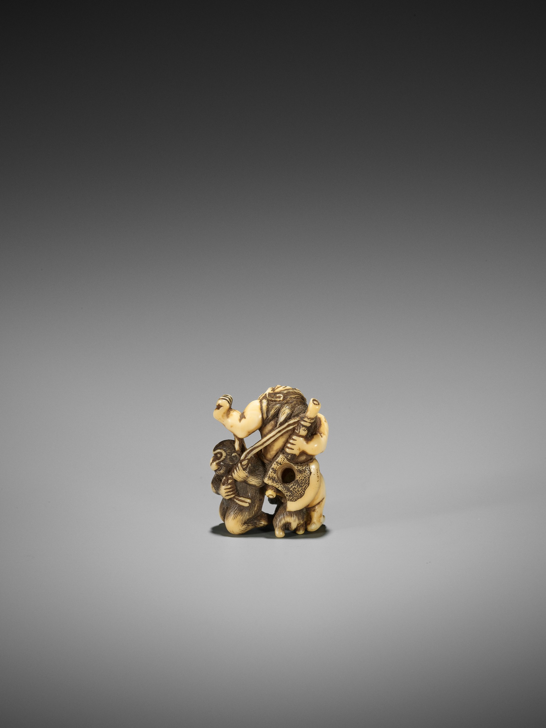 Lot 130 - OTOMAN: A RARE IVORY NETSUKE OF KINTARO WITH