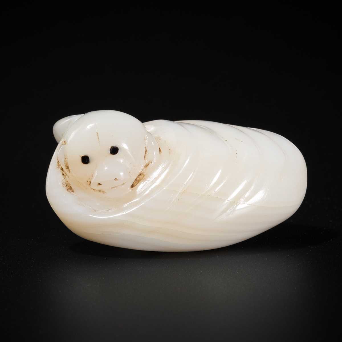 A RARE MOTHER-OF-PEARL NETSUKE OF A BAT (KOMORI)