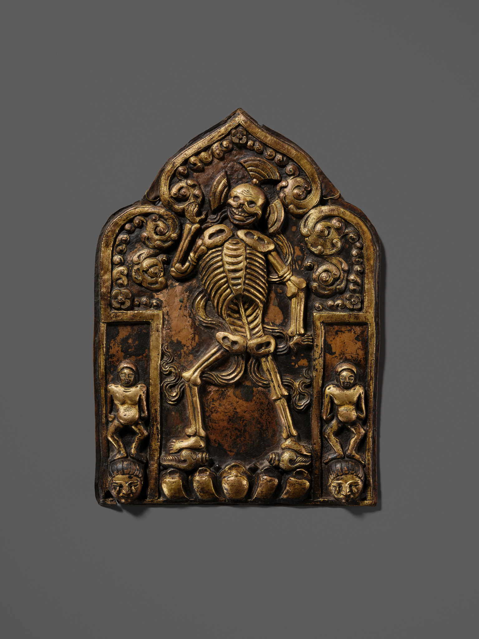 Lot 13 - A GILT COPPER-ALLOY REPOUSSÉ PLAQUE DEPICTING