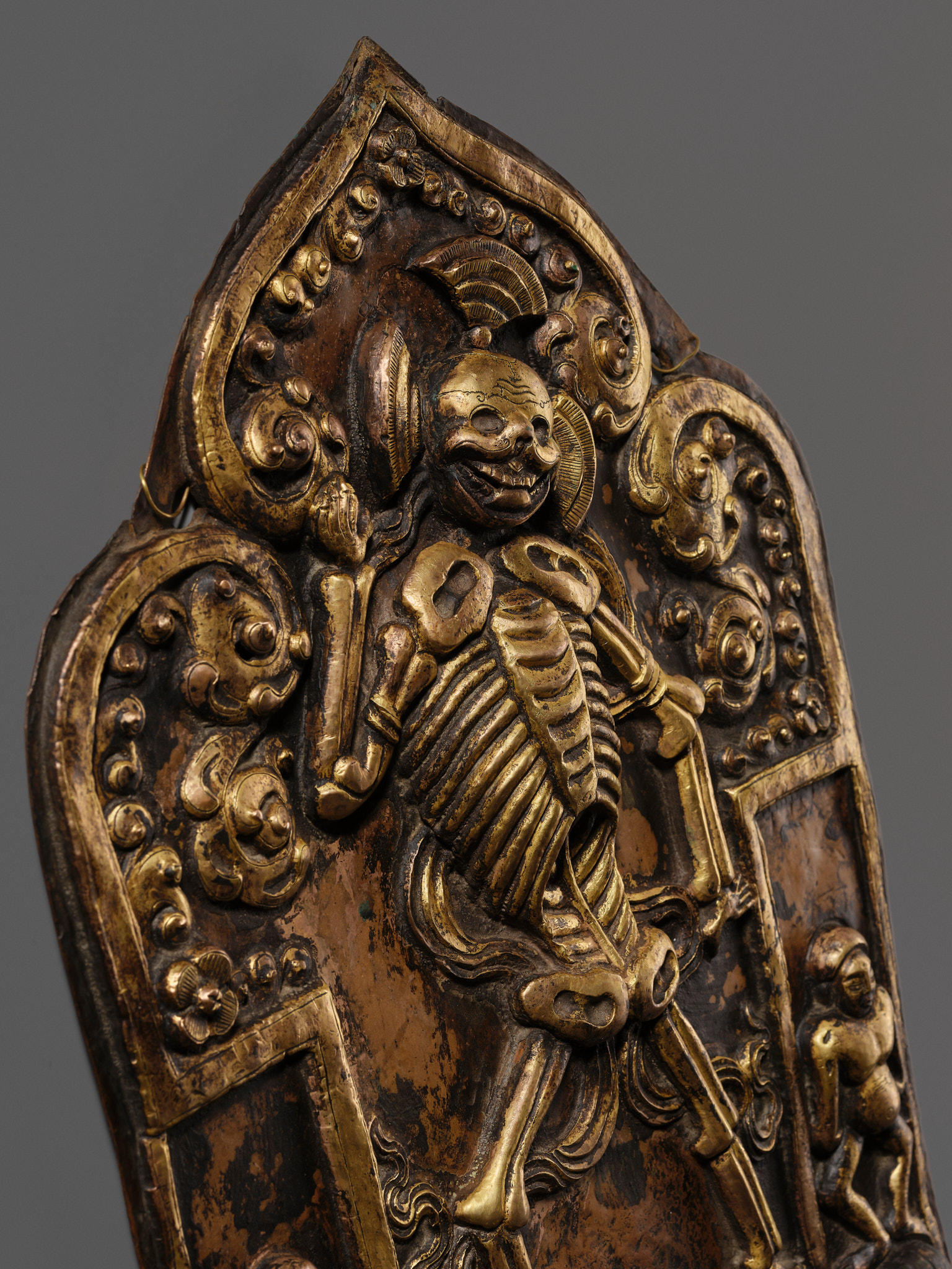Lot 13 - A GILT COPPER-ALLOY REPOUSSÉ PLAQUE DEPICTING
