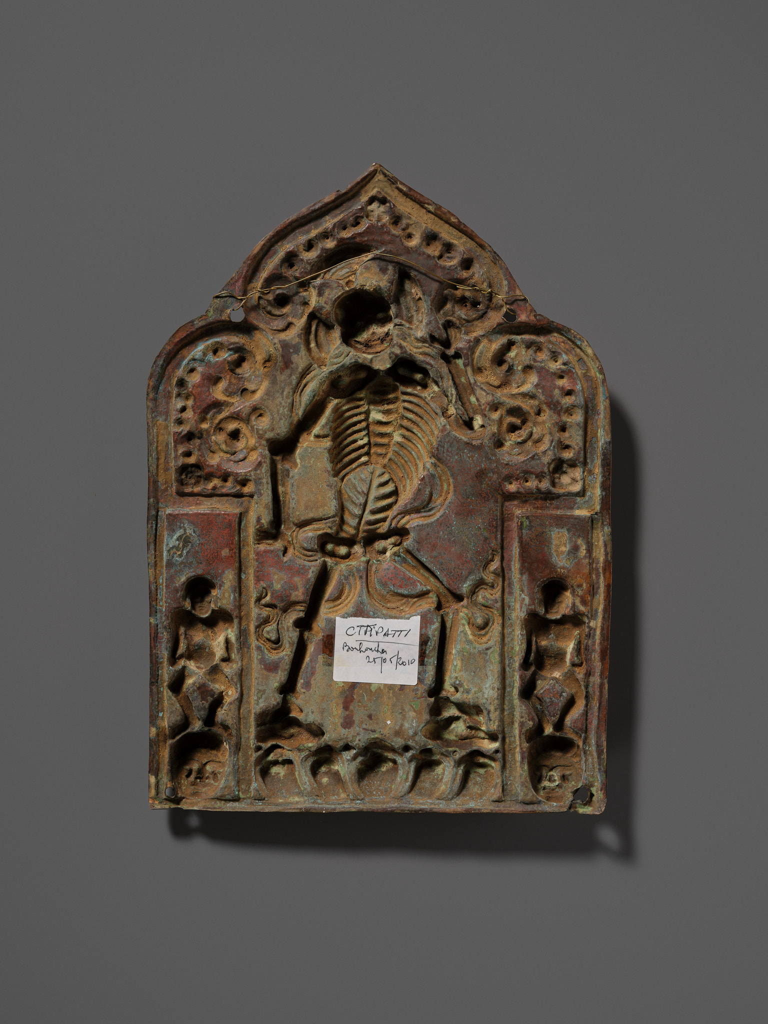 Lot 13 - A GILT COPPER-ALLOY REPOUSSÉ PLAQUE DEPICTING