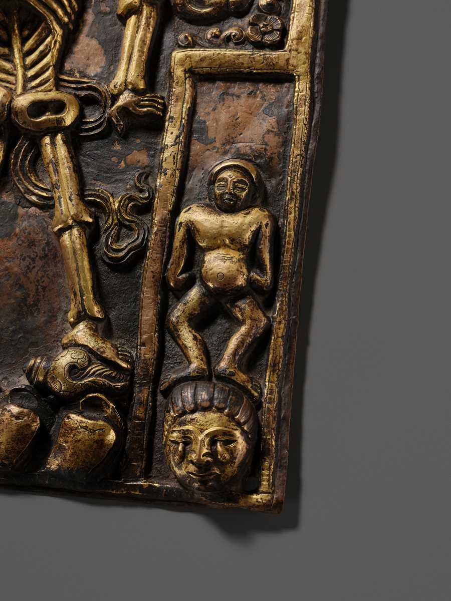 Lot 13 - A GILT COPPER-ALLOY REPOUSSÉ PLAQUE DEPICTING