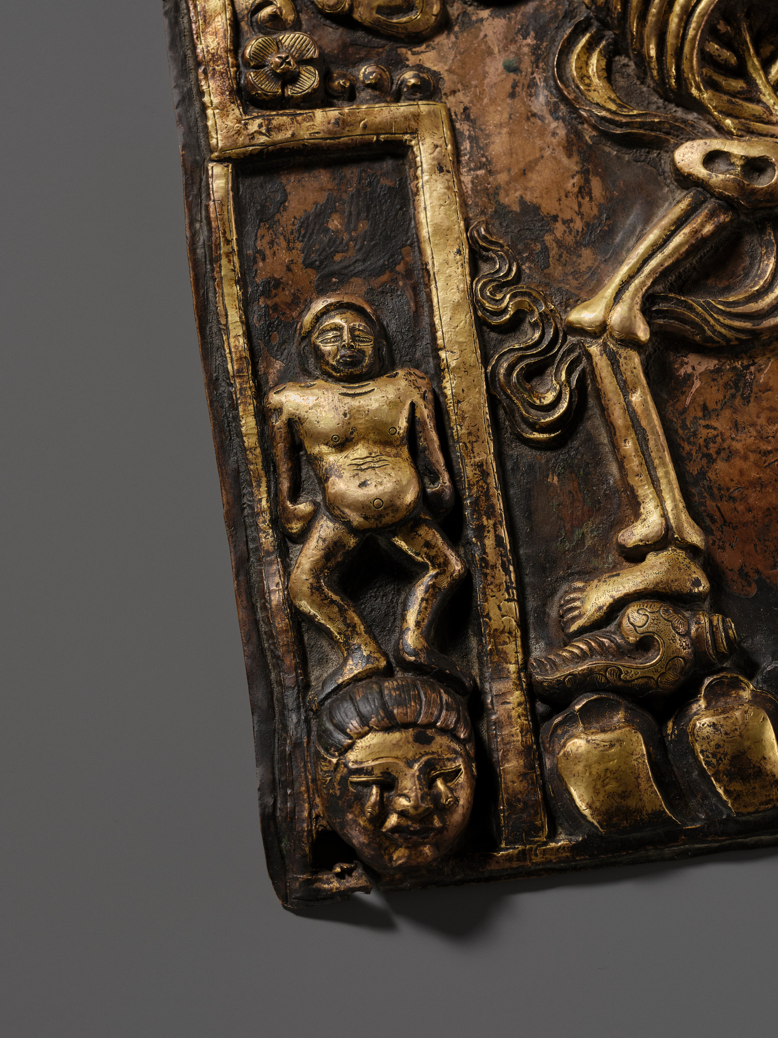 Lot 13 - A GILT COPPER-ALLOY REPOUSSÉ PLAQUE DEPICTING