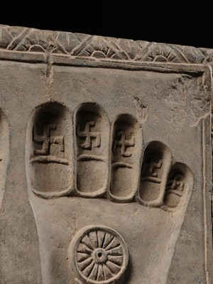 Lot 187 - A SCHIST RELIEF OF THE FOOTPRINTS OF BUDDHA,