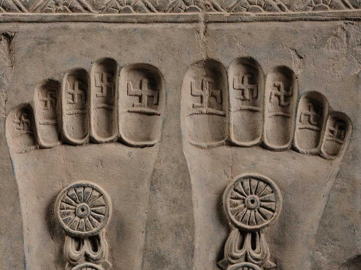 Lot 187 - A SCHIST RELIEF OF THE FOOTPRINTS OF BUDDHA,