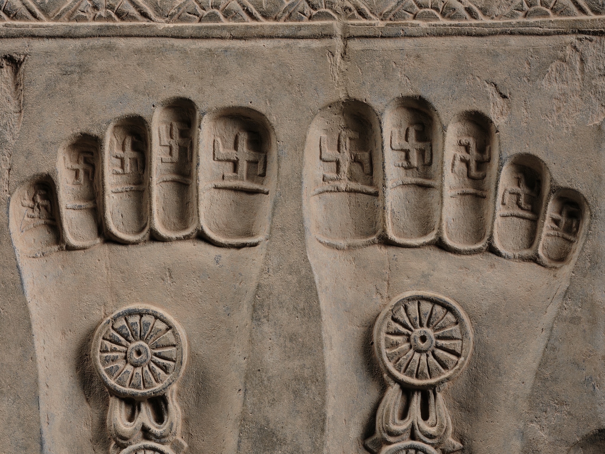 Lot 187 - A SCHIST RELIEF OF THE FOOTPRINTS OF BUDDHA,