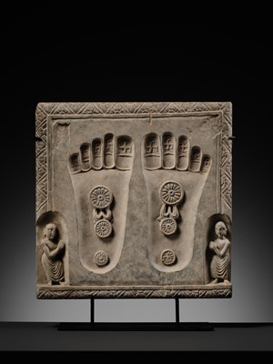 Lot 187 - A SCHIST RELIEF OF THE FOOTPRINTS OF BUDDHA,