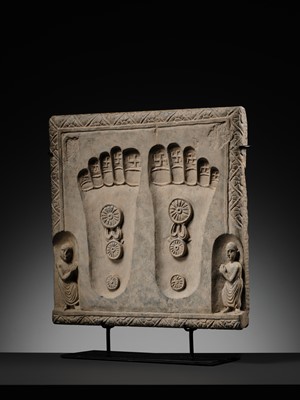 Lot 187 - A SCHIST RELIEF OF THE FOOTPRINTS OF BUDDHA,