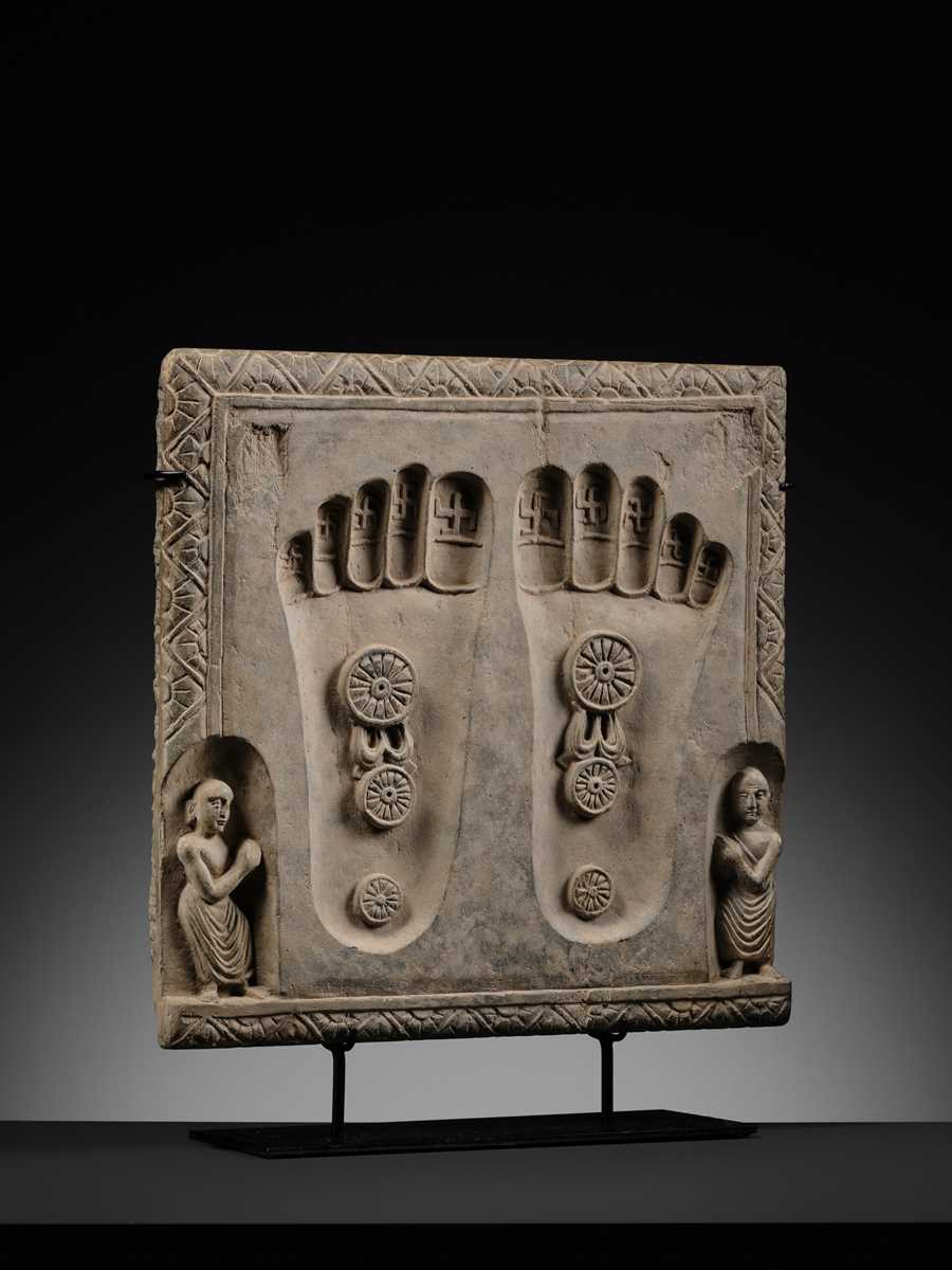 Lot 187 - A SCHIST RELIEF OF THE FOOTPRINTS OF BUDDHA,