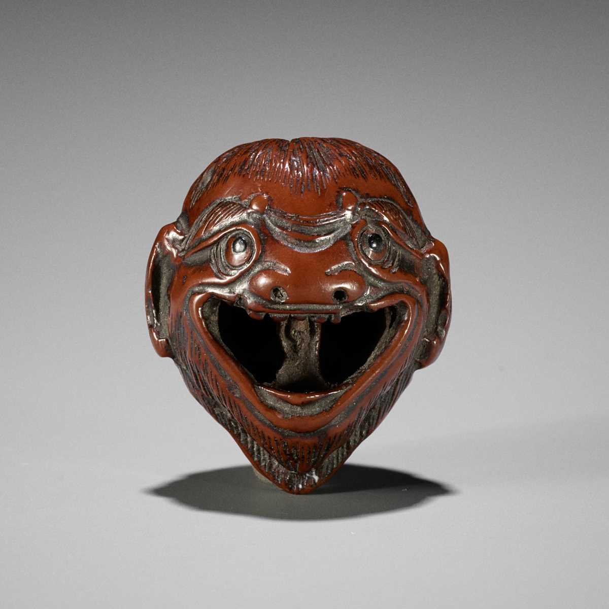 Lot 362 - MINRYOSAI: A VERY RARE KURUMI MASK NETSUKE