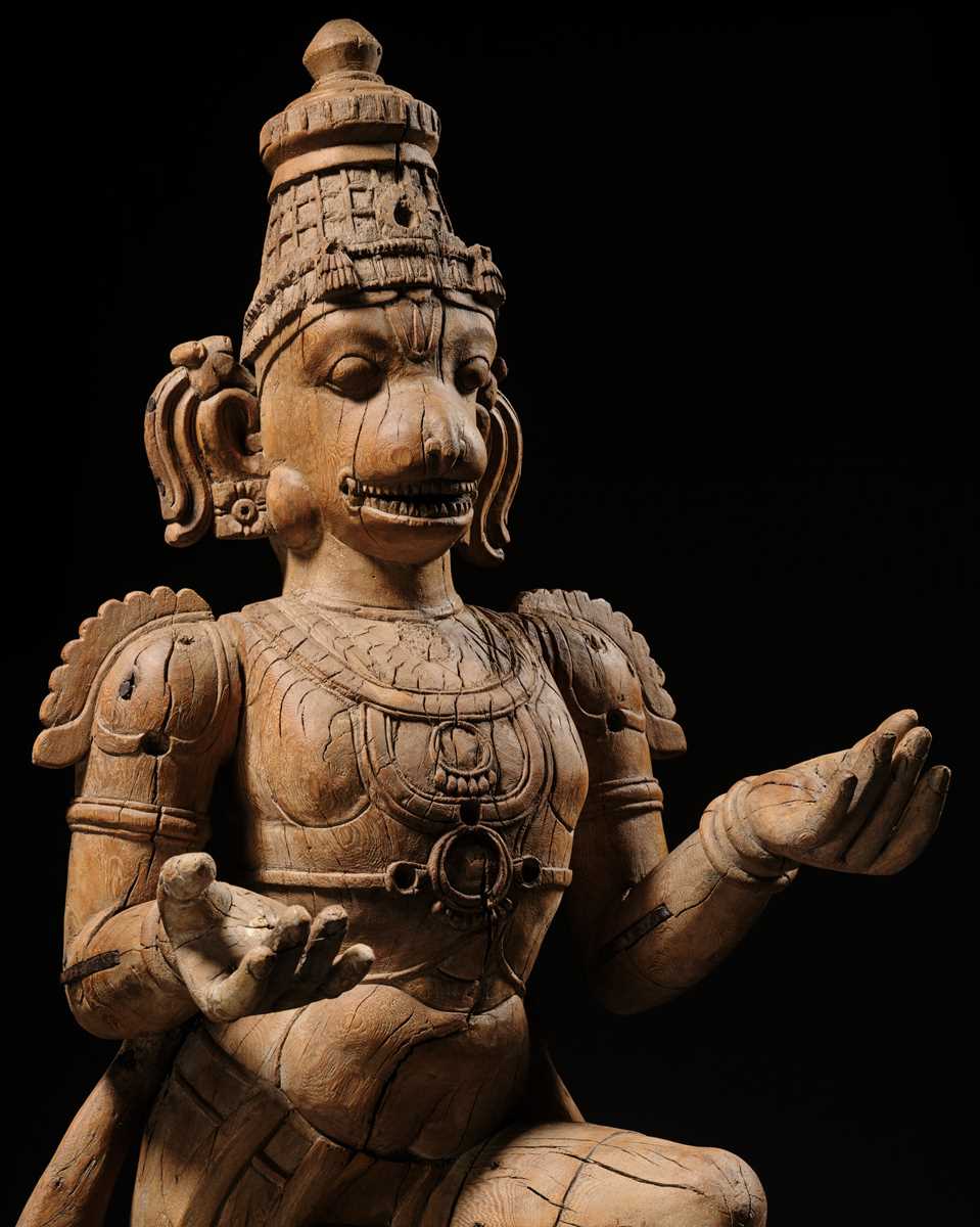 Lot 215 - A MONUMENTAL (142 CM) WOOD FIGURE OF HANUMAN,