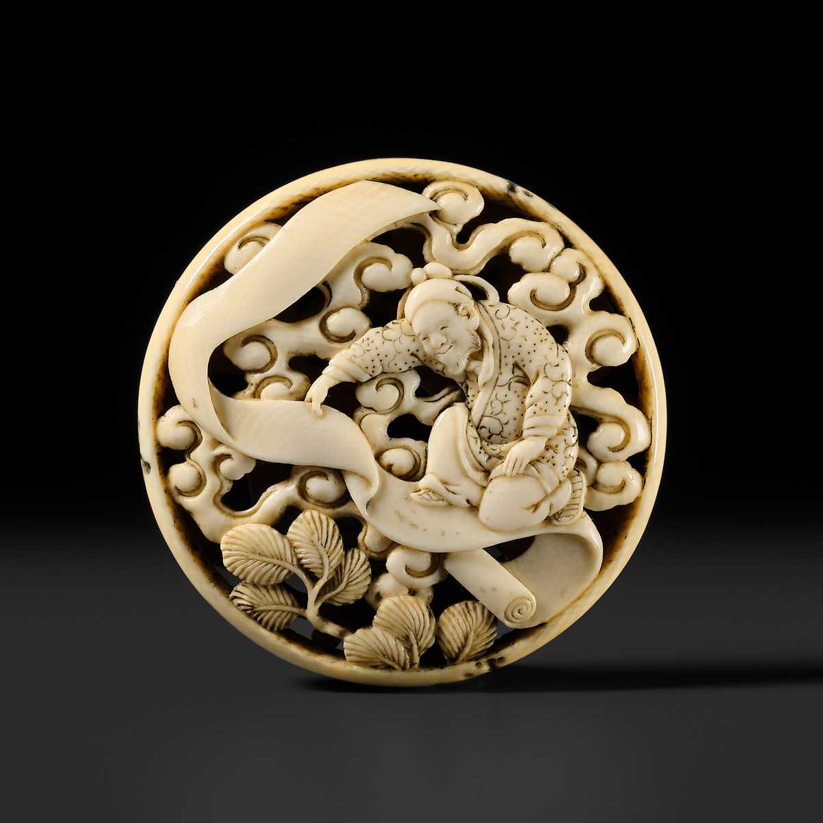 Lot 335 - OSAI: A RARE IVORY RYUSA MANJU NETSUKE