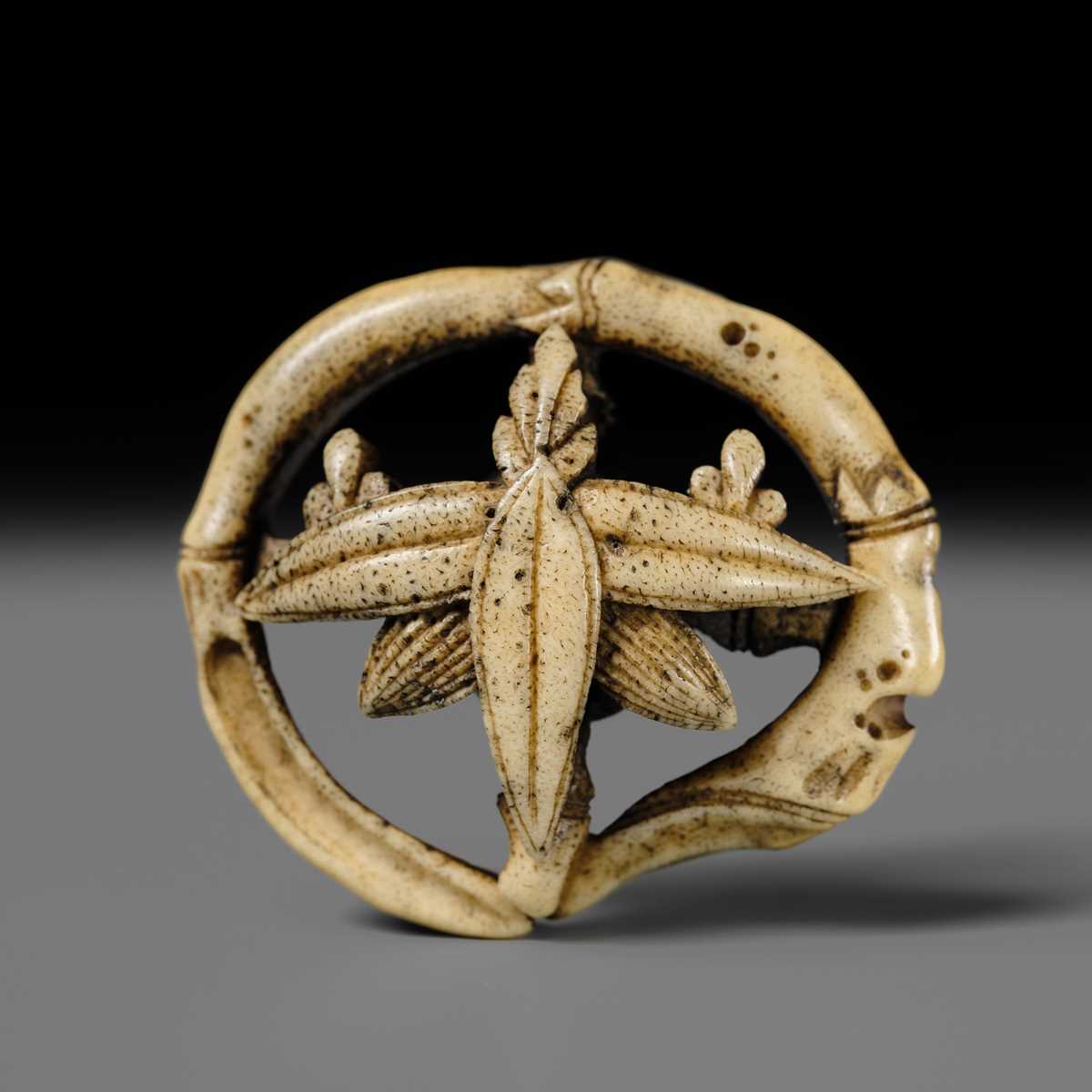 Lot 327 - A FINE ANTLER NETSUKE OF A SASA (BAMBOO