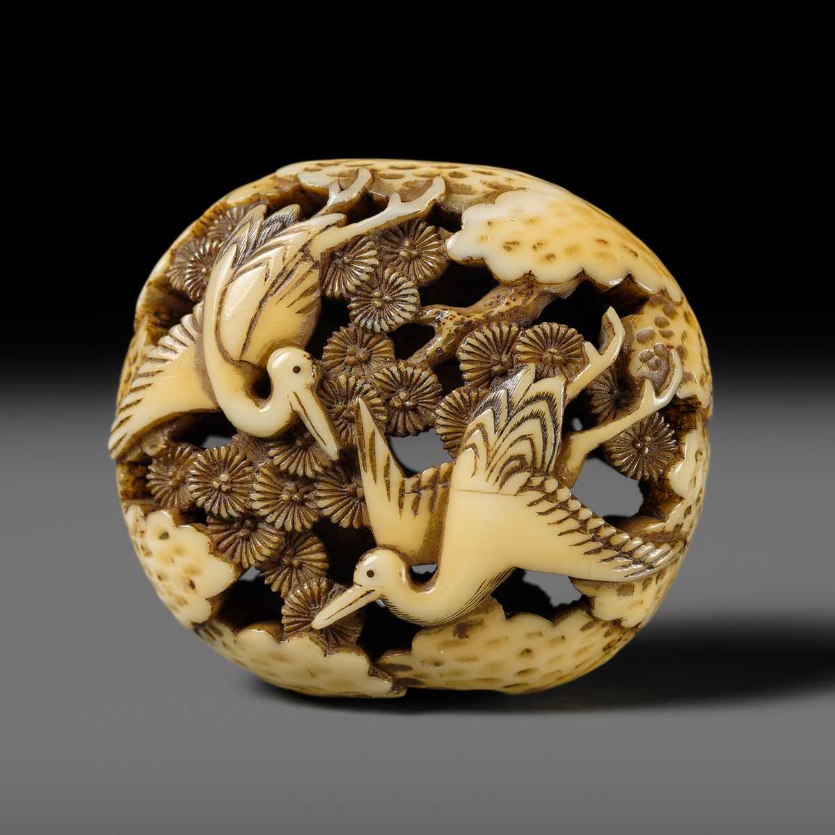 Lot 334 - A FINE WALRUS TUSK RYUSA MANJU NETSUKE OF