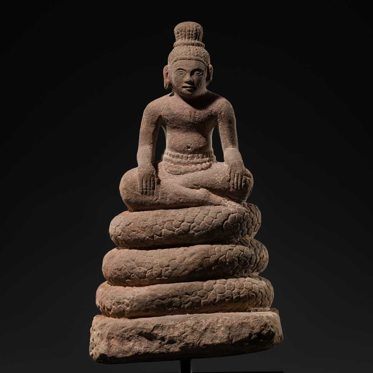 Lot 648 - A SANDSTONE FIGURE OF BUDDHA MUCHALINDA,