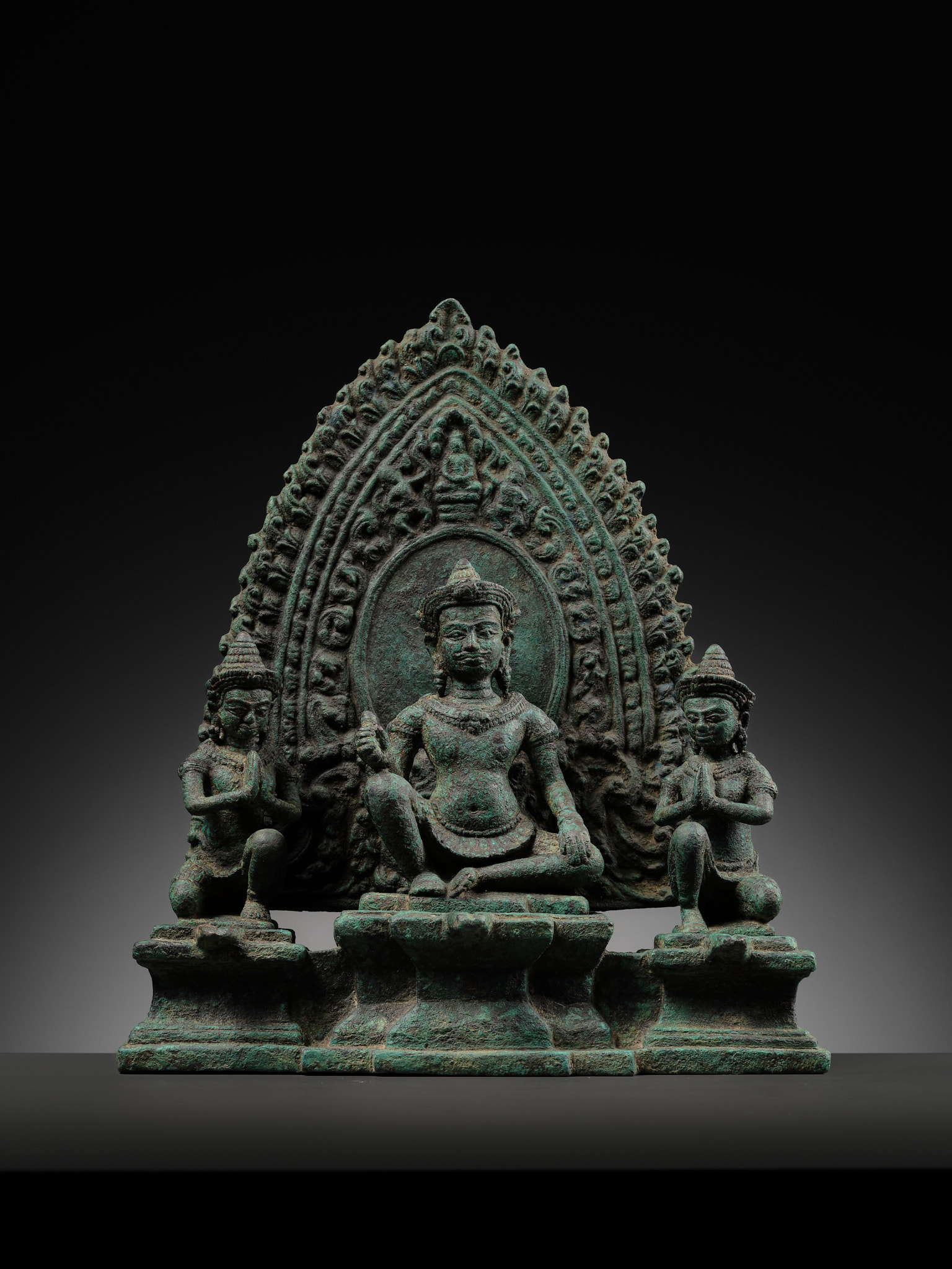 Lot 231 - A BRONZE TRIAD OF VISHVAKARMAN WITH
