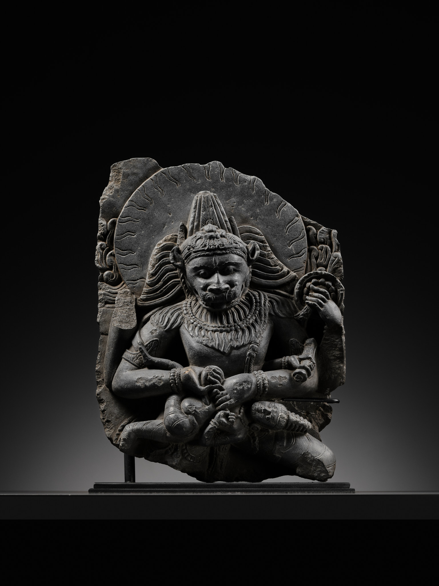 Lot 205 - A RARE BLACK STONE STELE OF NARASIMHA