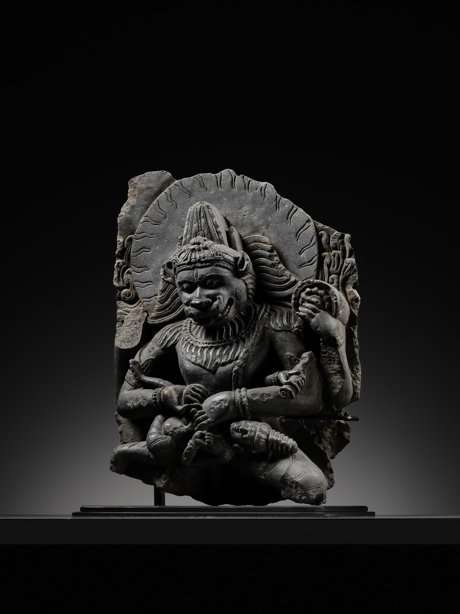 Lot 205 - A RARE BLACK STONE STELE OF NARASIMHA