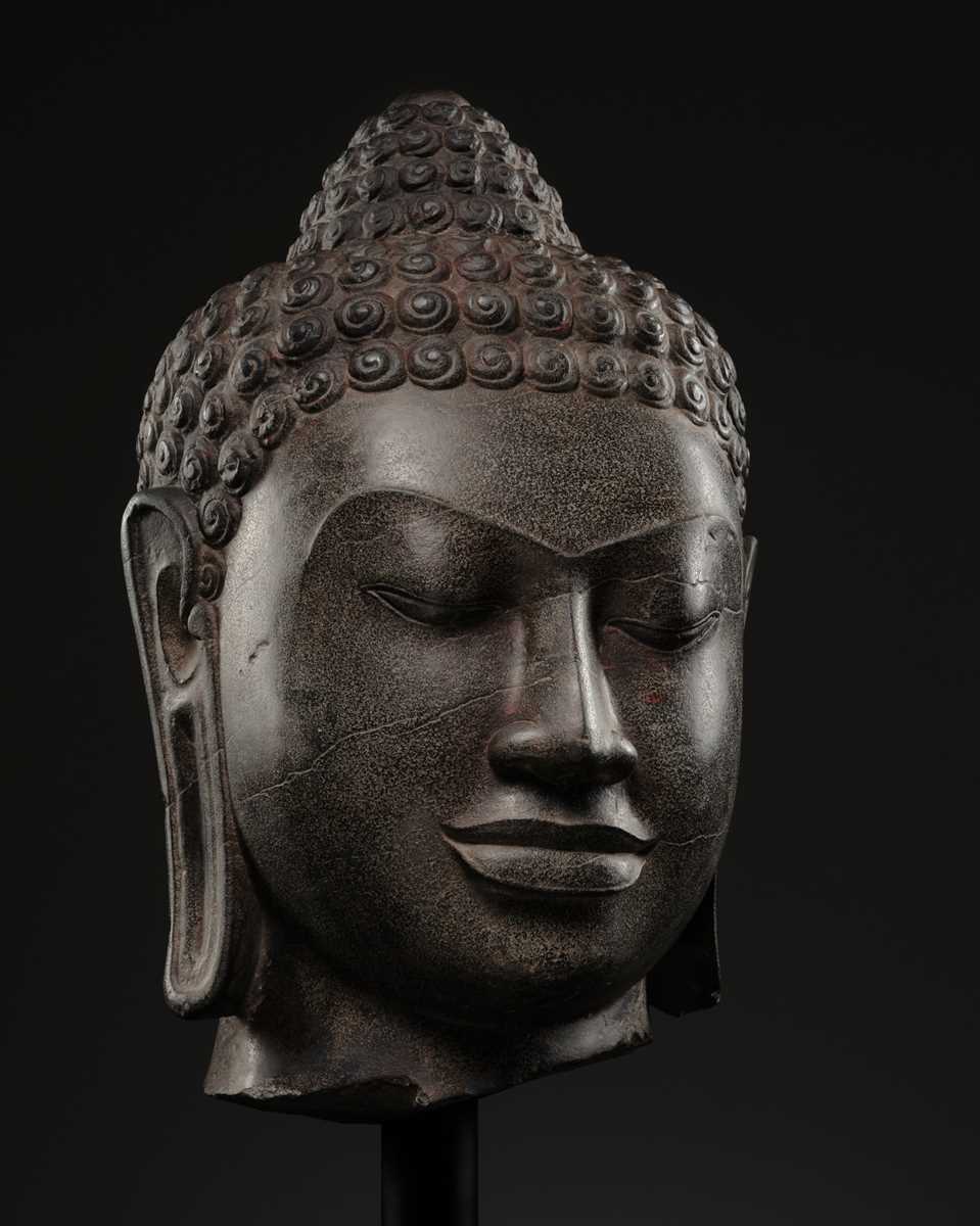 Lot 236 - A RARE AND MONUMENTAL SANDSTONE HEAD OF