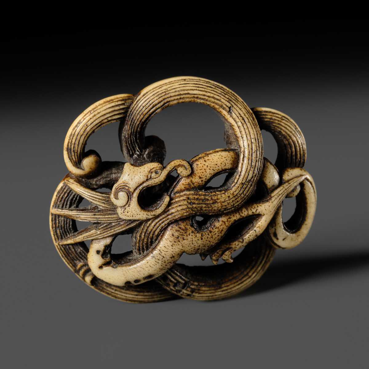 Lot 325 - A FINE ANTLER RYUSA MANJU NETSUKE OF A WATER